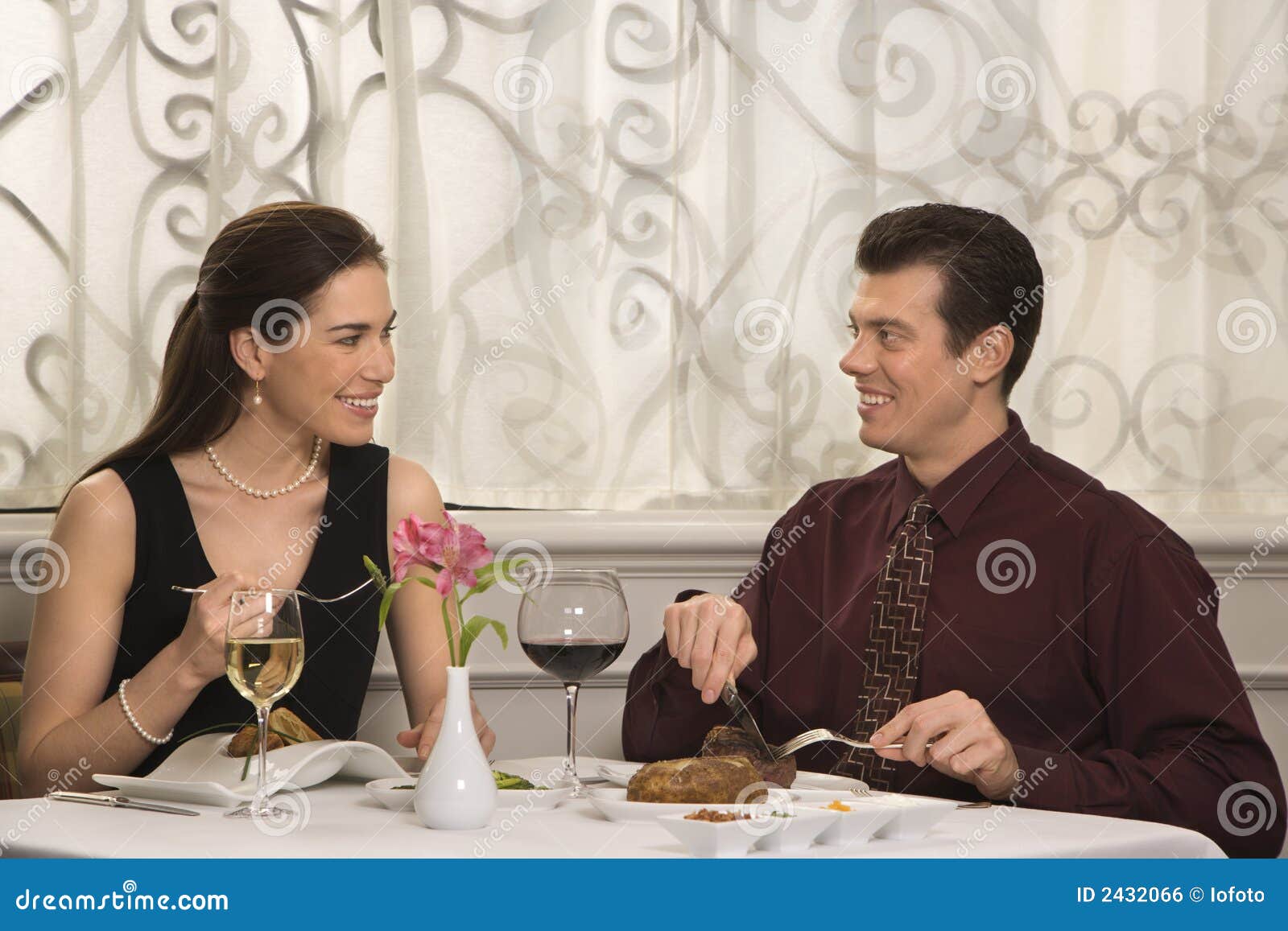Couple Dining at Restaurant. Stock Photo - Image of brunette, female ...