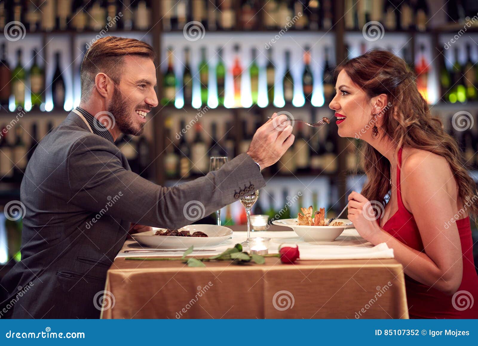 Couple at dinner together stock photo. Image of indoor - 85107352