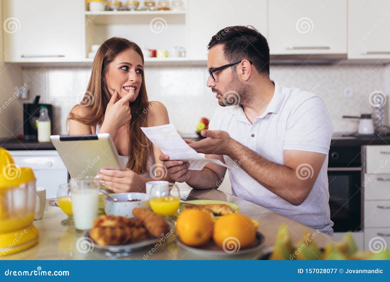 Couple Discussing about Home Budget in the Kitchen Stock Image - Image ...