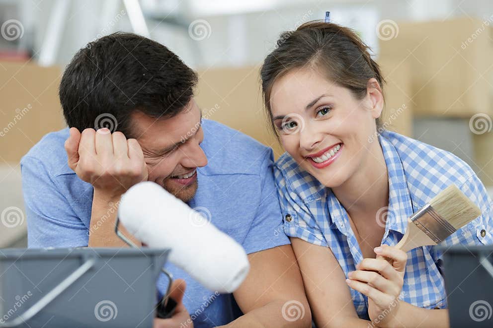 Couple doing diy together stock image. Image of painter - 296716969
