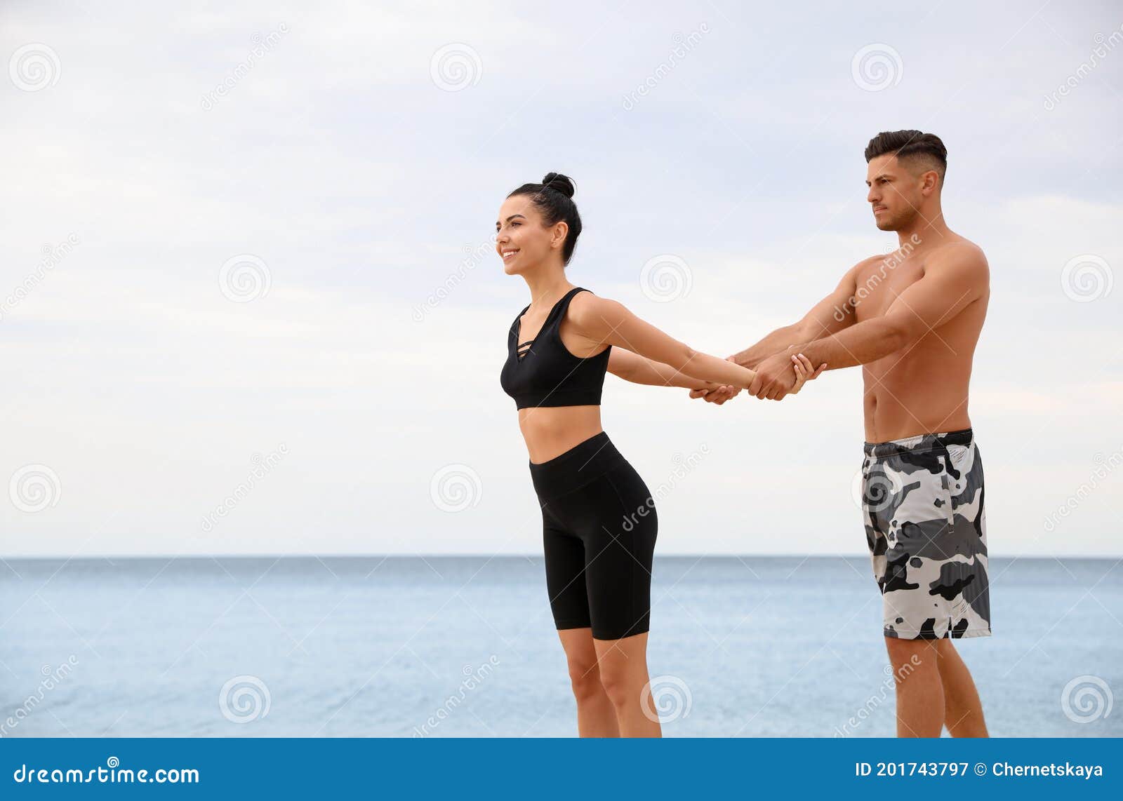 Couple Doing Exercise Together on Beach, Space for Text. Body Training ...