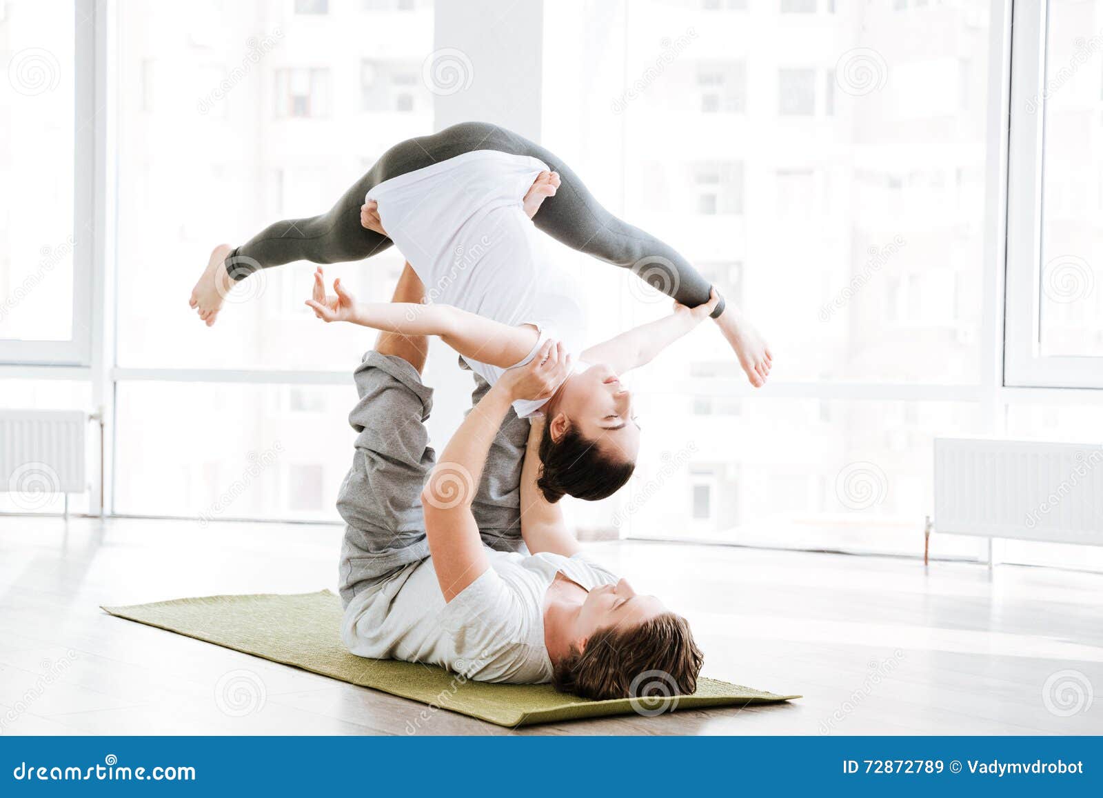 Couple Doing Flexibility Workout in Yoga Studio Stock Image - Image of ...