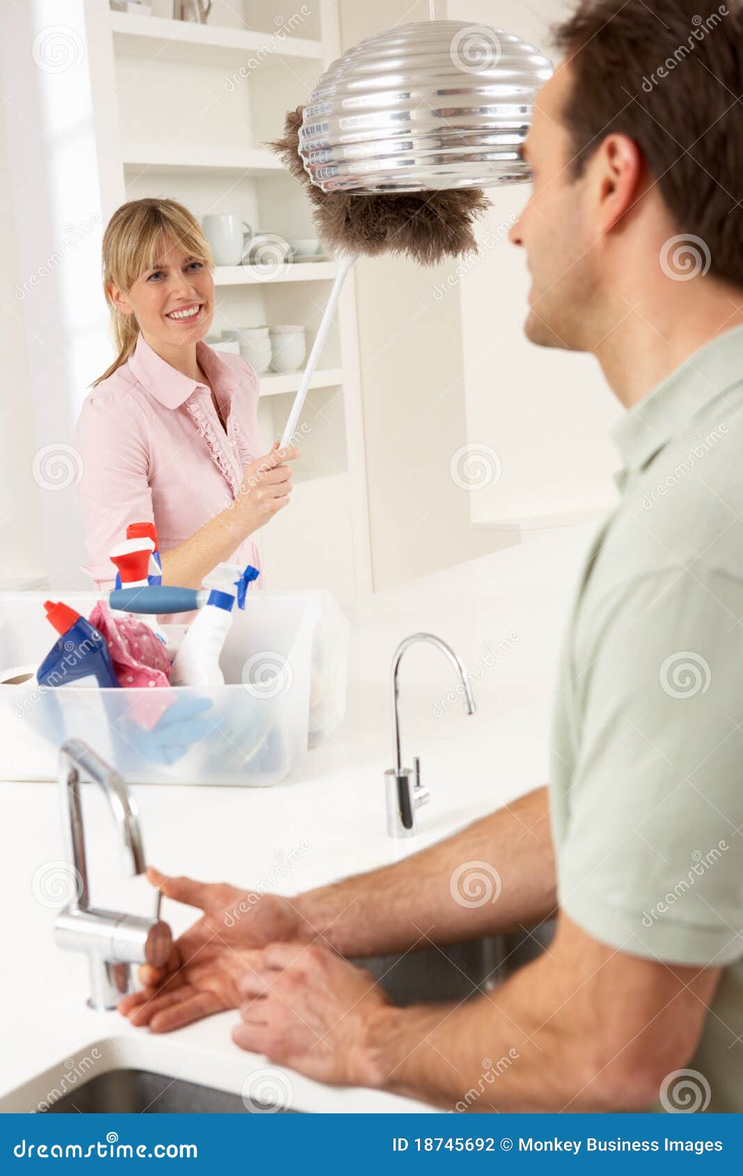 Couple Doing Housework in Kitchen Together Stock Photo - Image of ...