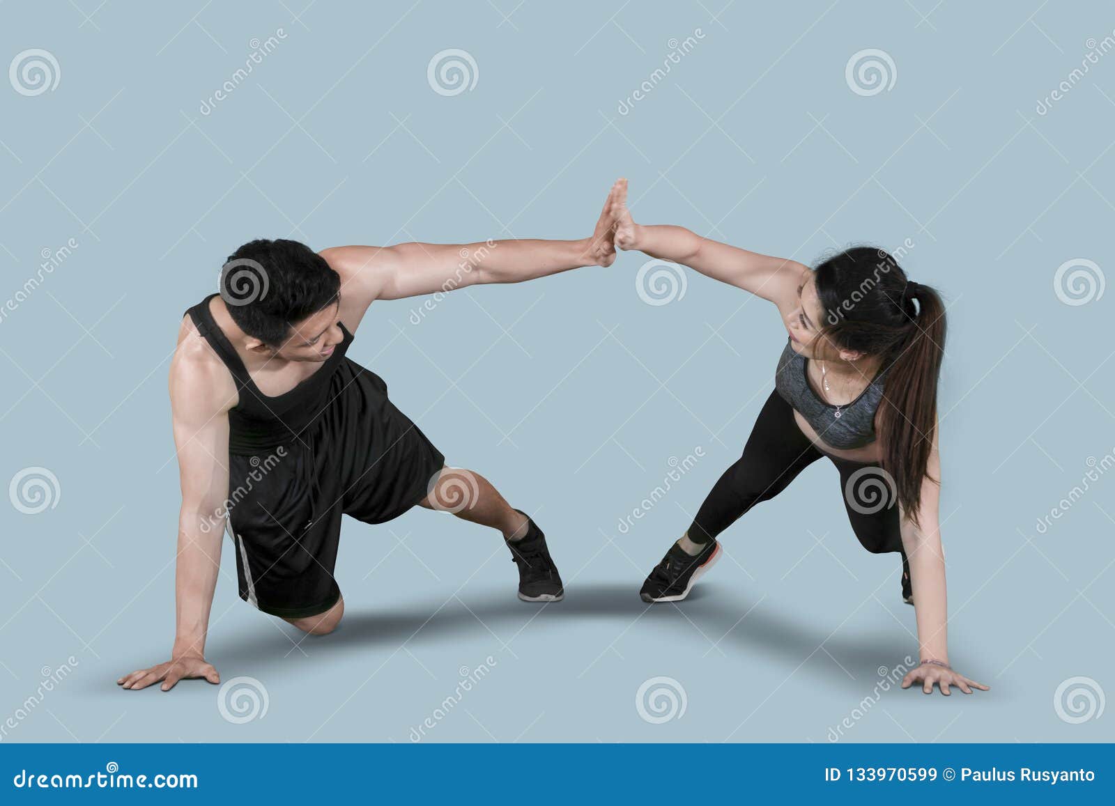 Couple Doing Plank Pose and Making High Five Stock Image - Image of ...