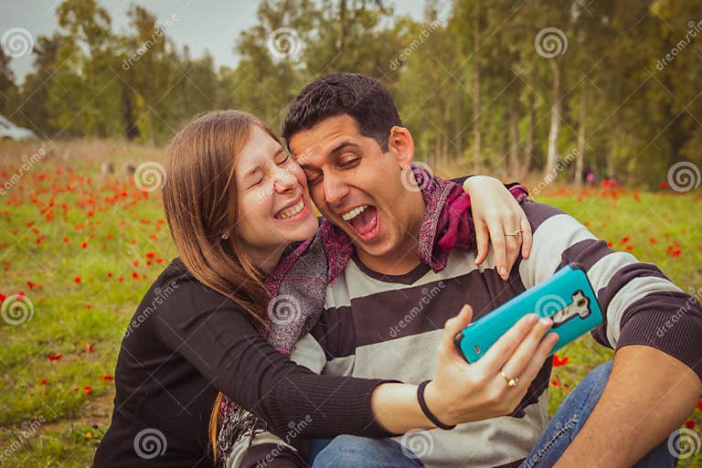Couple Doing Silly And Funny Faces While Taking Selfie Picture W Stock