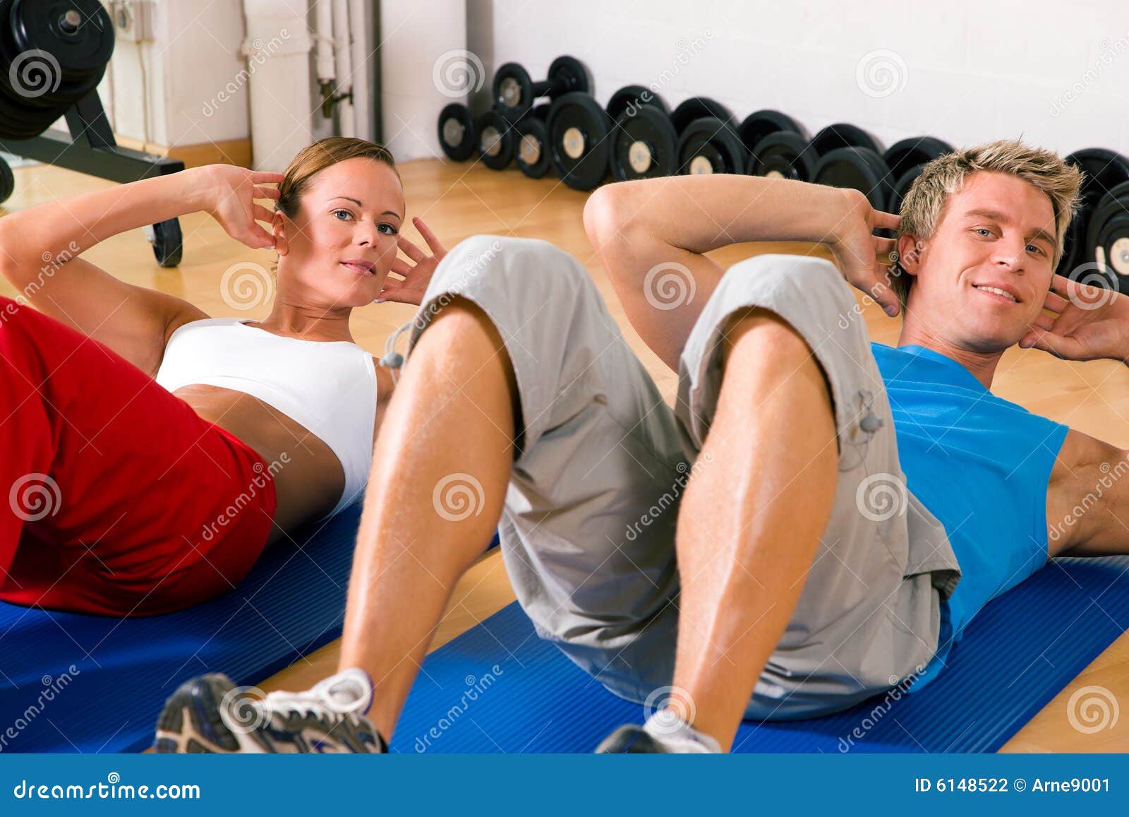 Couple doing Sit-ups stock photo. Image of people, active - 6148522
