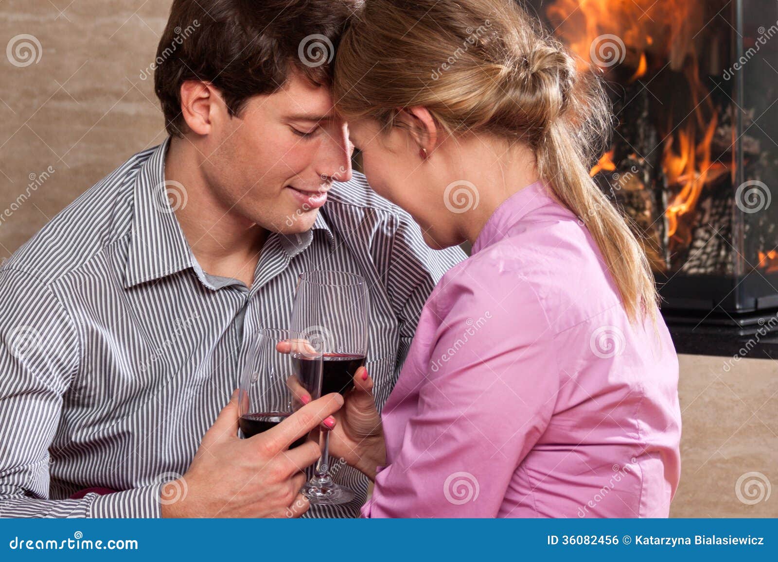Couple drinking by fire stock photo. Image of relation - 36082456