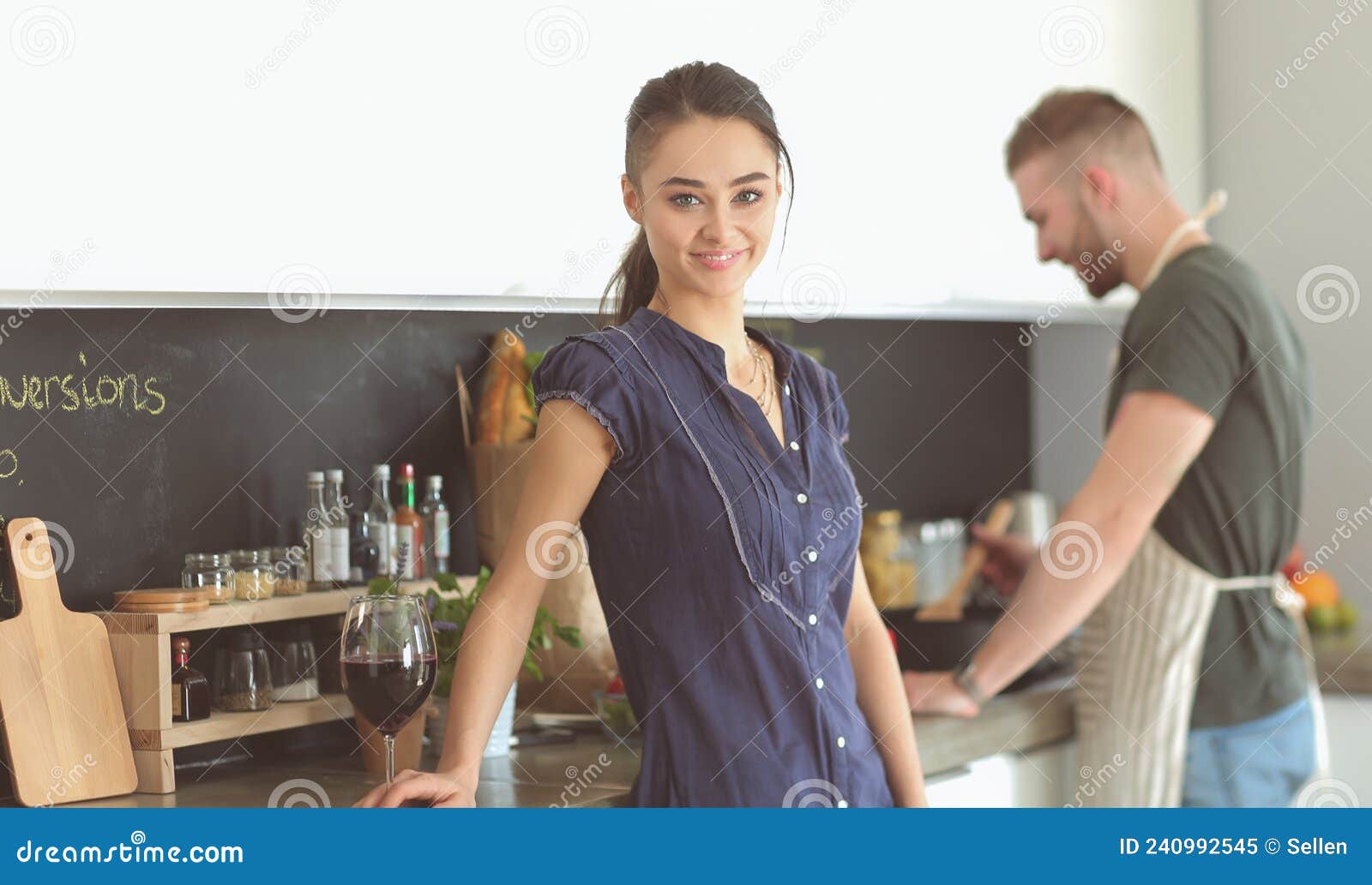 Couple Drinking Wine while Cooking in the Kitchen Stock Image - Image ...
