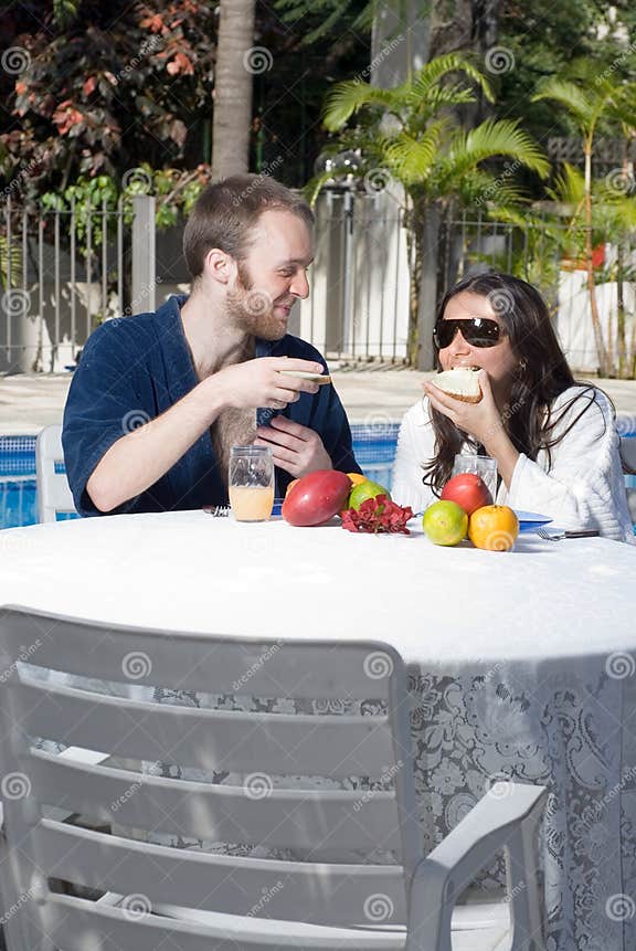 Couple Eat by Pool - Vertical Stock Photo - Image of ethnicity, outside ...