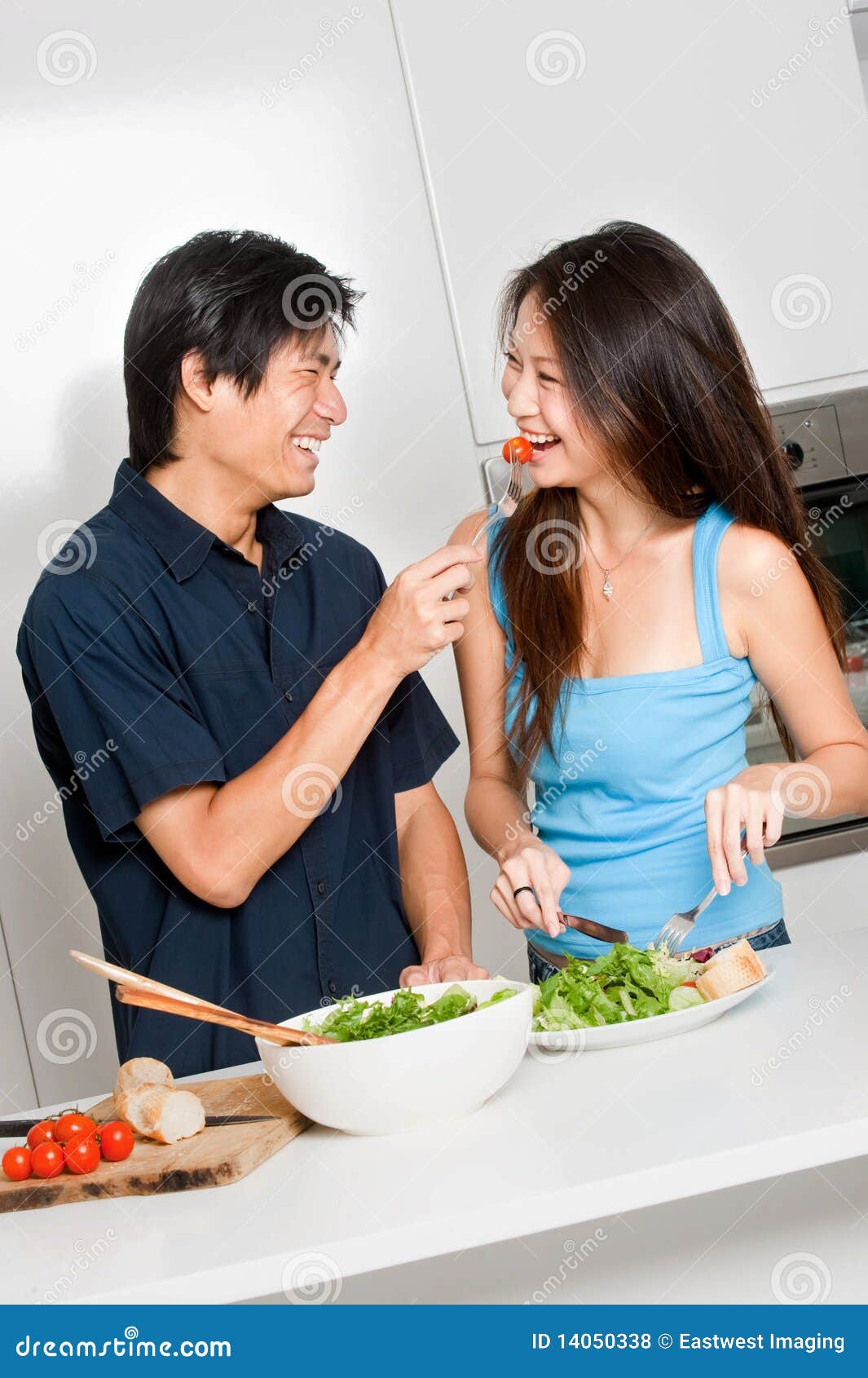 Couple Eating stock photo. Image of looking, adults, woman - 14050338