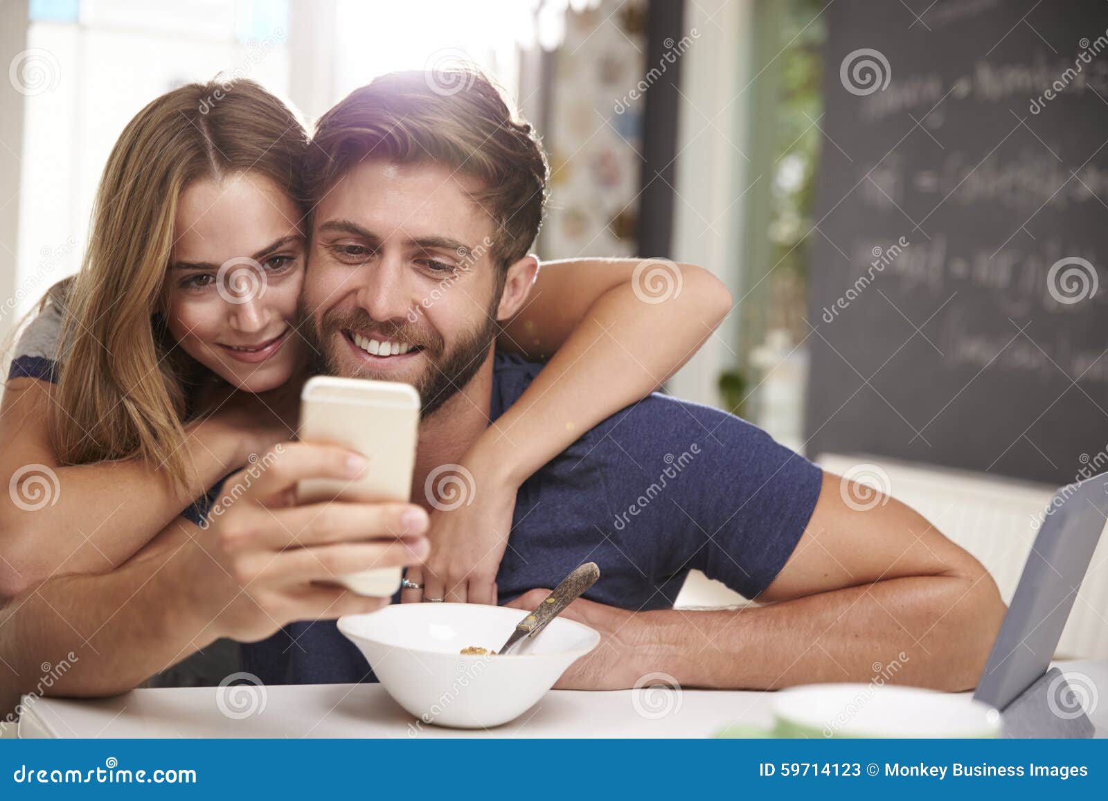 Couple Eating Breakfast Using Digital Tablet and Phone Stock Image ...