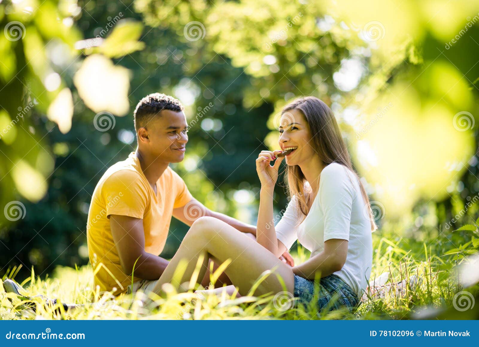 Couple eating chocolate stock photo. Image of food, young - 78102096