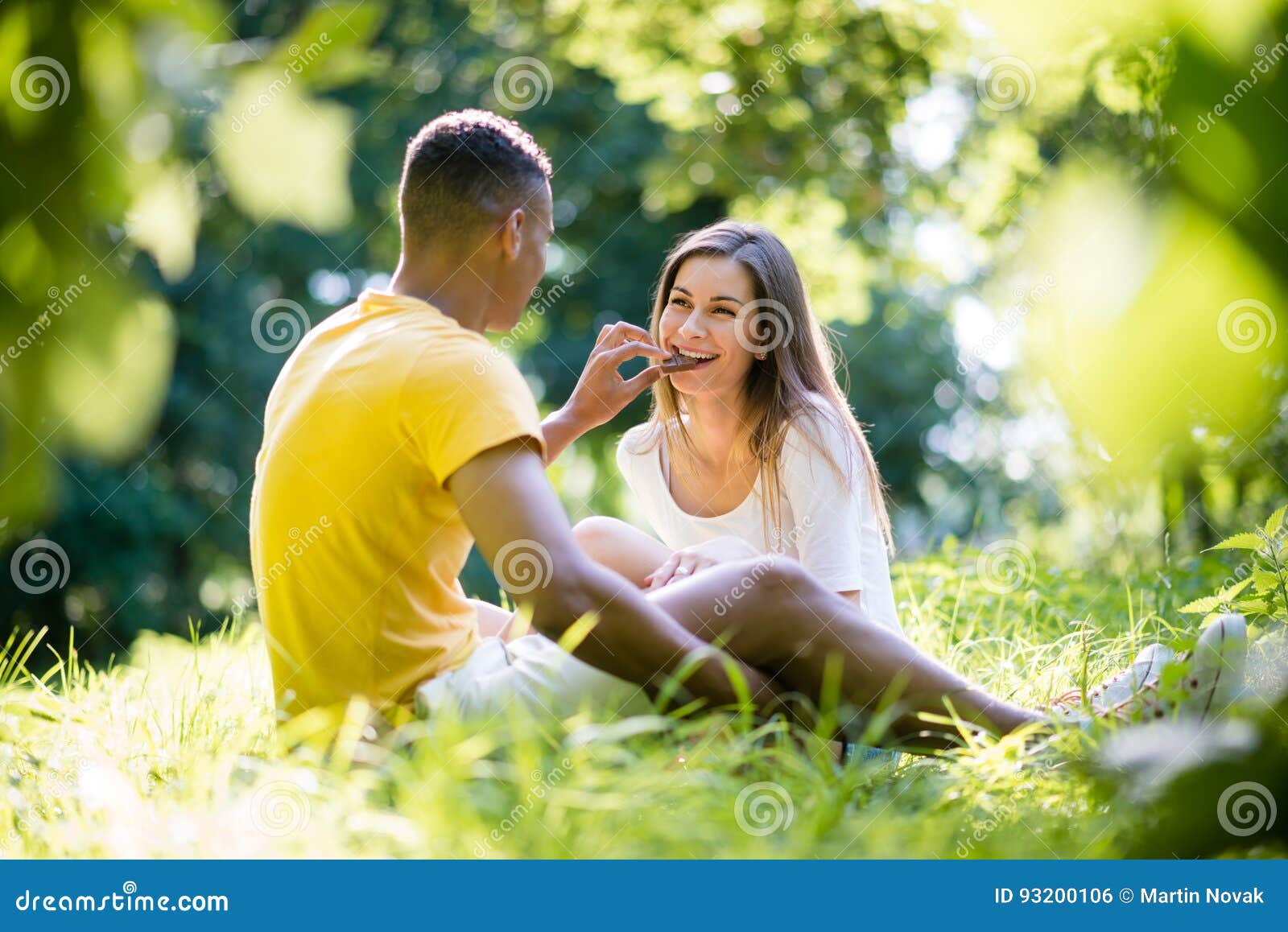 Couple eating chocolate stock photo. Image of pleasure - 93200106