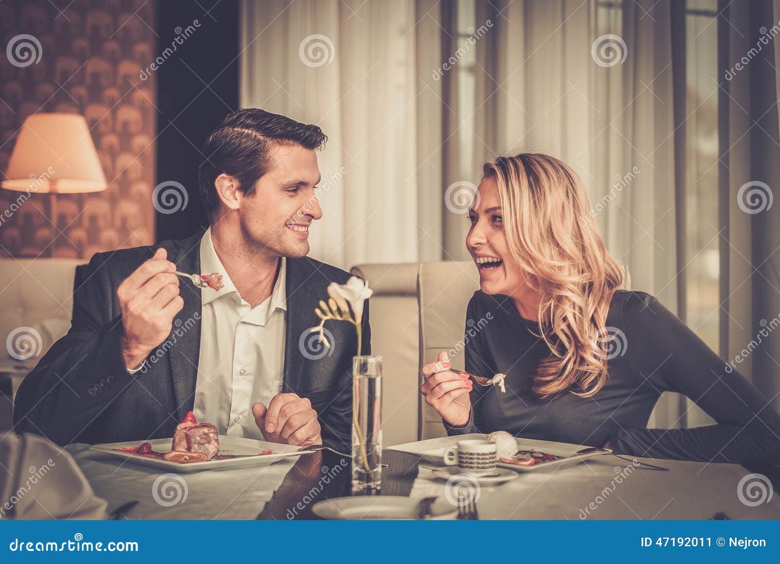 Couple eating dessert stock image. Image of positive - 47192011