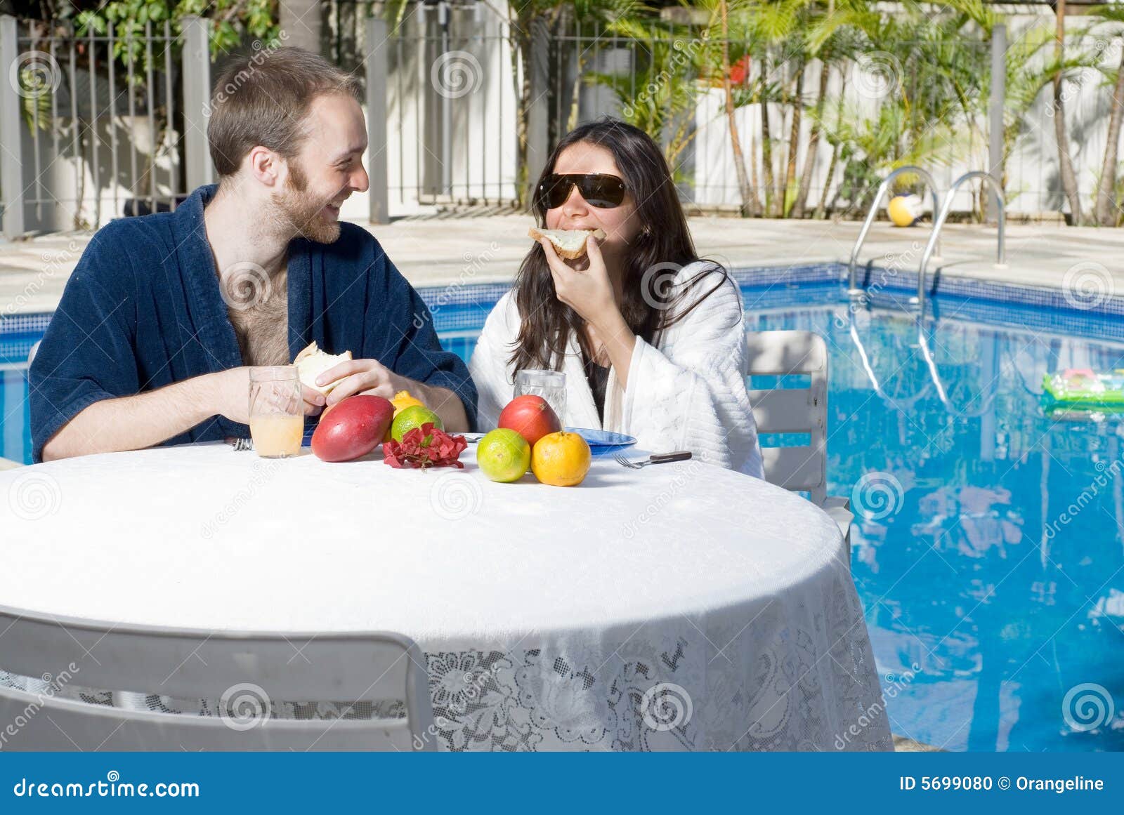 Couple Eating Fruits Near Pool - Horizontal Stock Photo - Image of ...