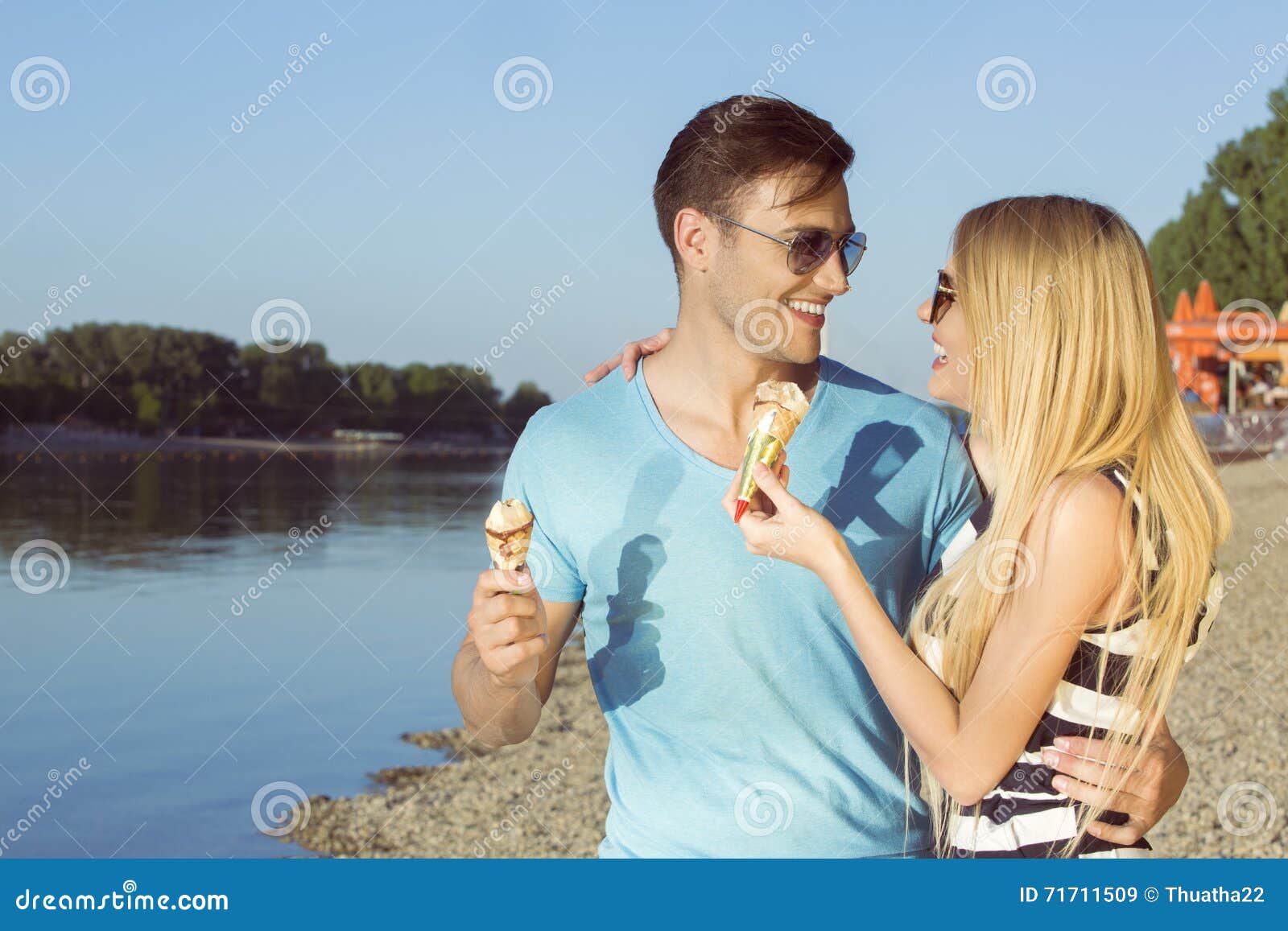 Couple Eating Ice Cream and Having Fun at the Beach Stock Image - Image ...