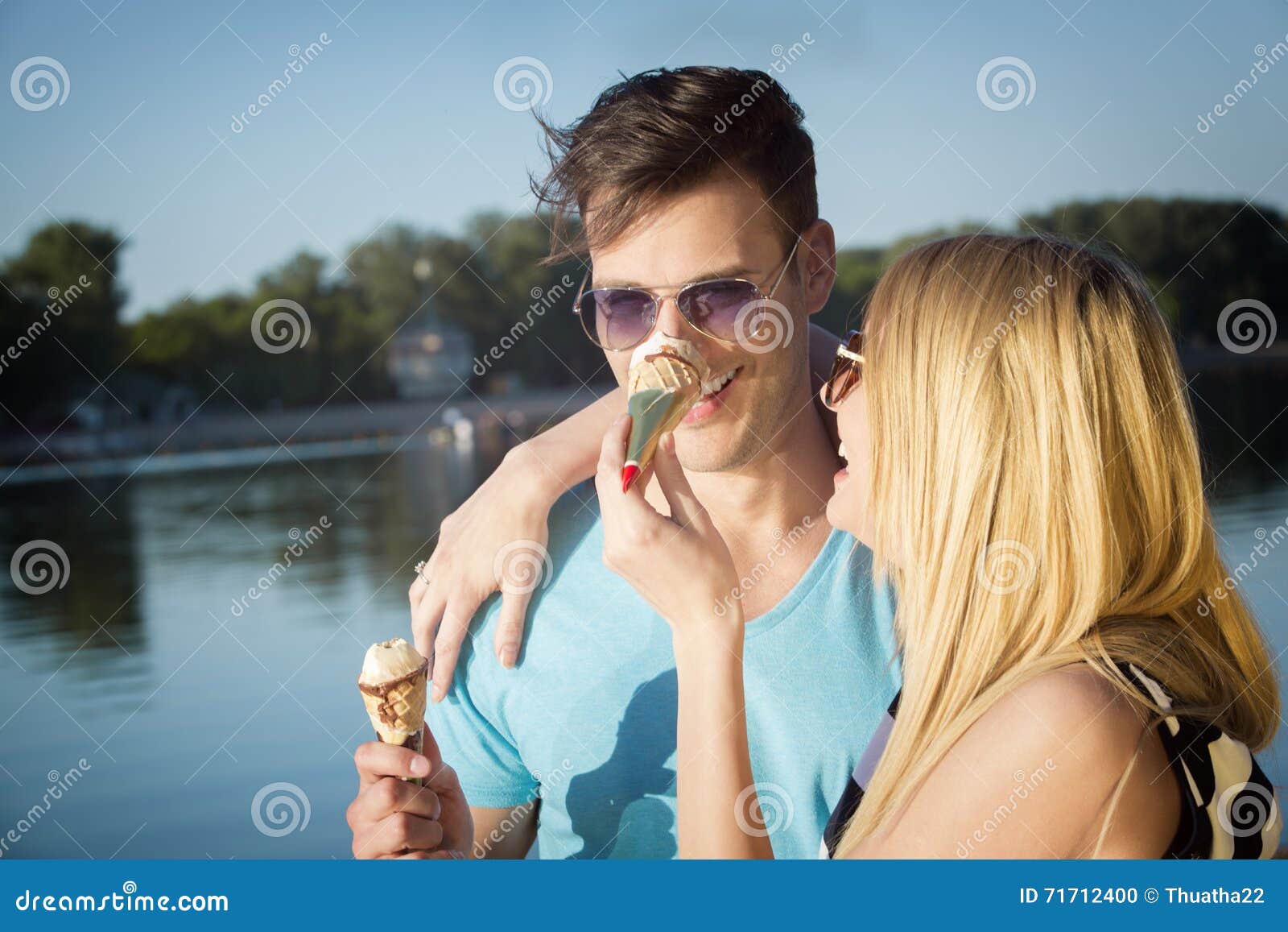 Couple Eating Ice Cream and Having Fun at the Beach Stock Photo - Image ...