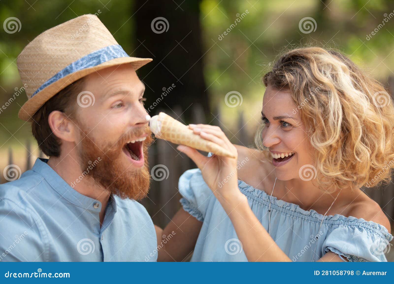 Couple Eating Ice Cream and Having Fun in Park Stock Photo - Image of ...