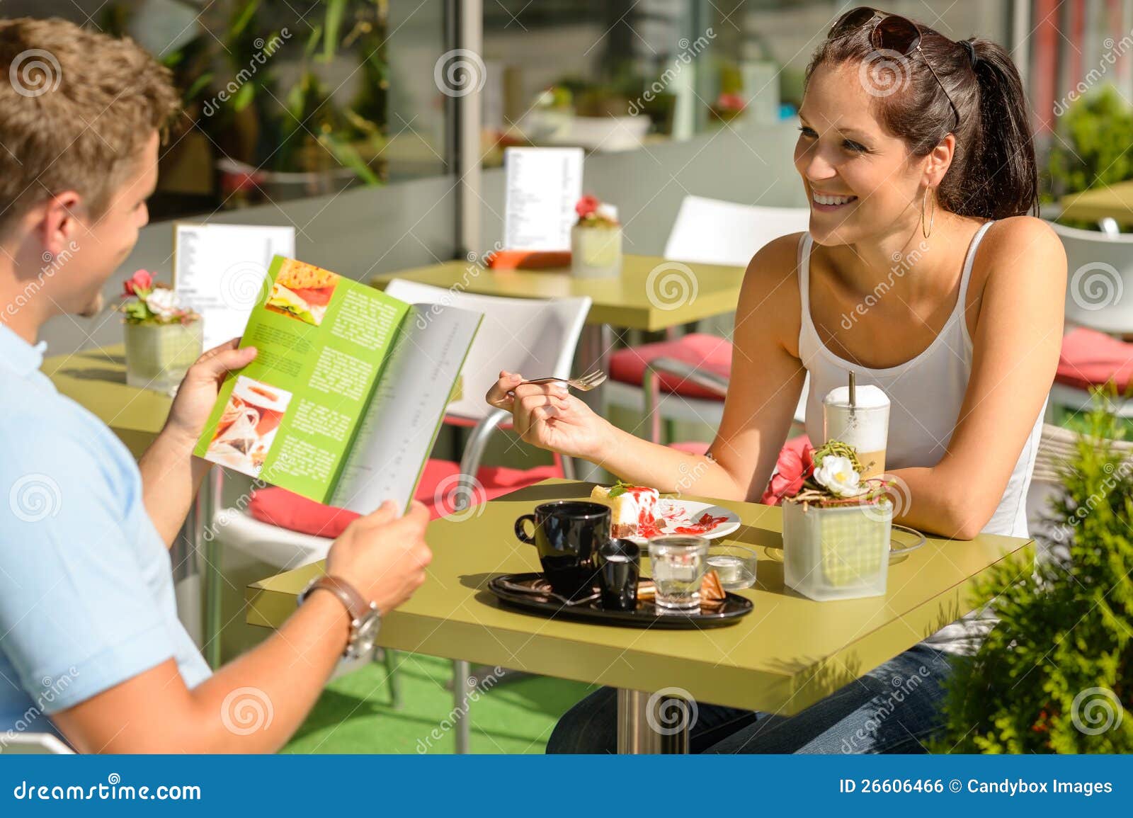 Couple Eating Looking At Menu Cafe Restaurant Stock Photo - Image: 26606466