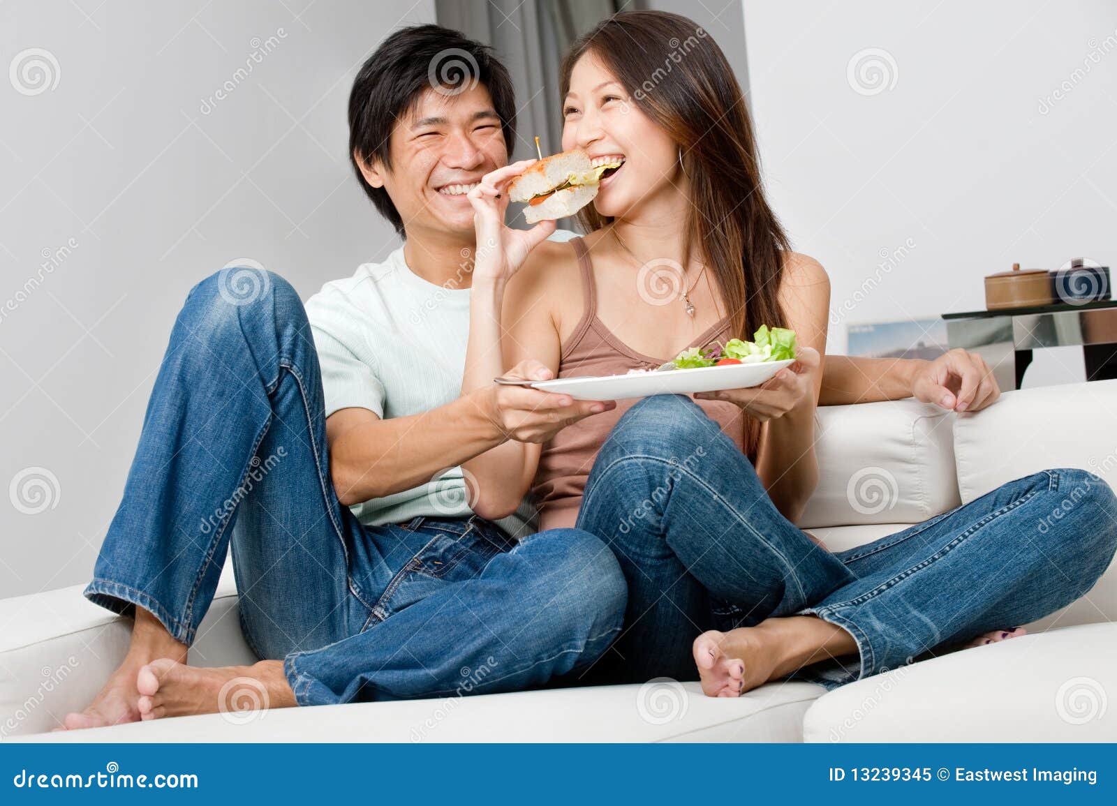 Couple Eating Together stock image. Image of looking - 13239345