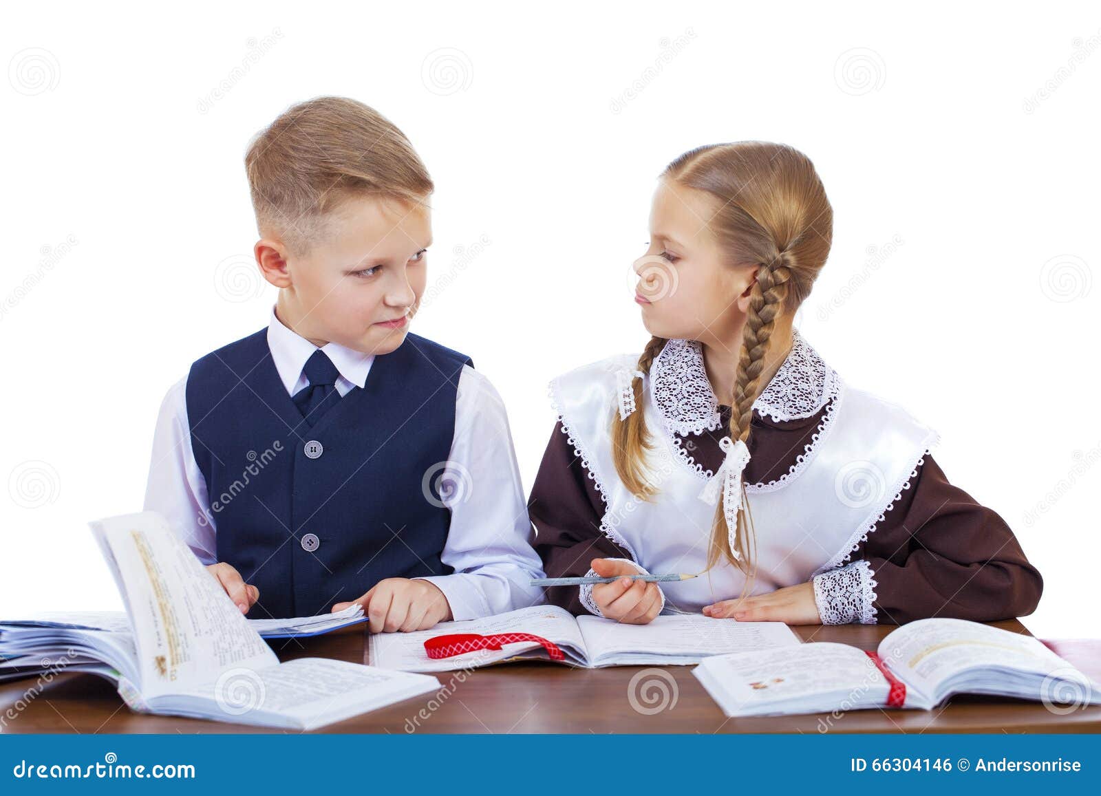 A Couple of Elementary School Students Sit at a Desk Stock Photo ...