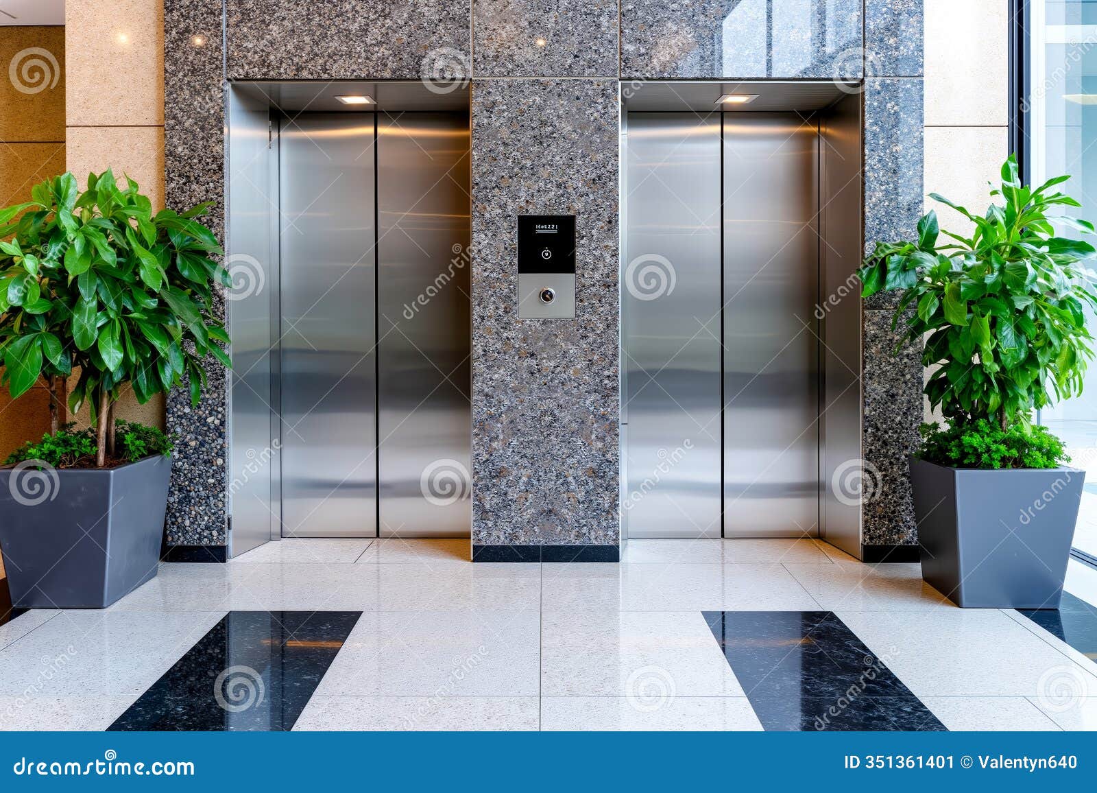 A Couple of Elevators in a Building with Plants in Pots Stock Image ...