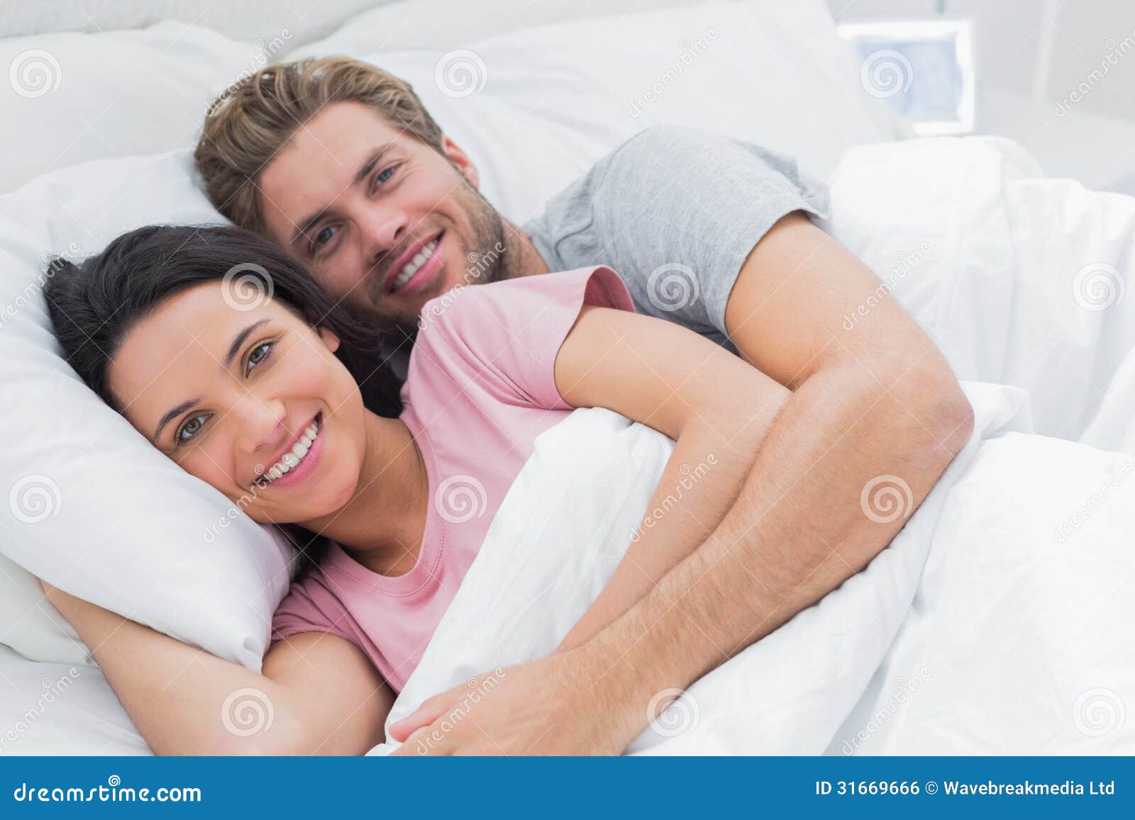 Couple embracing in bed stock photo. Image of hair, hugging - 31669666