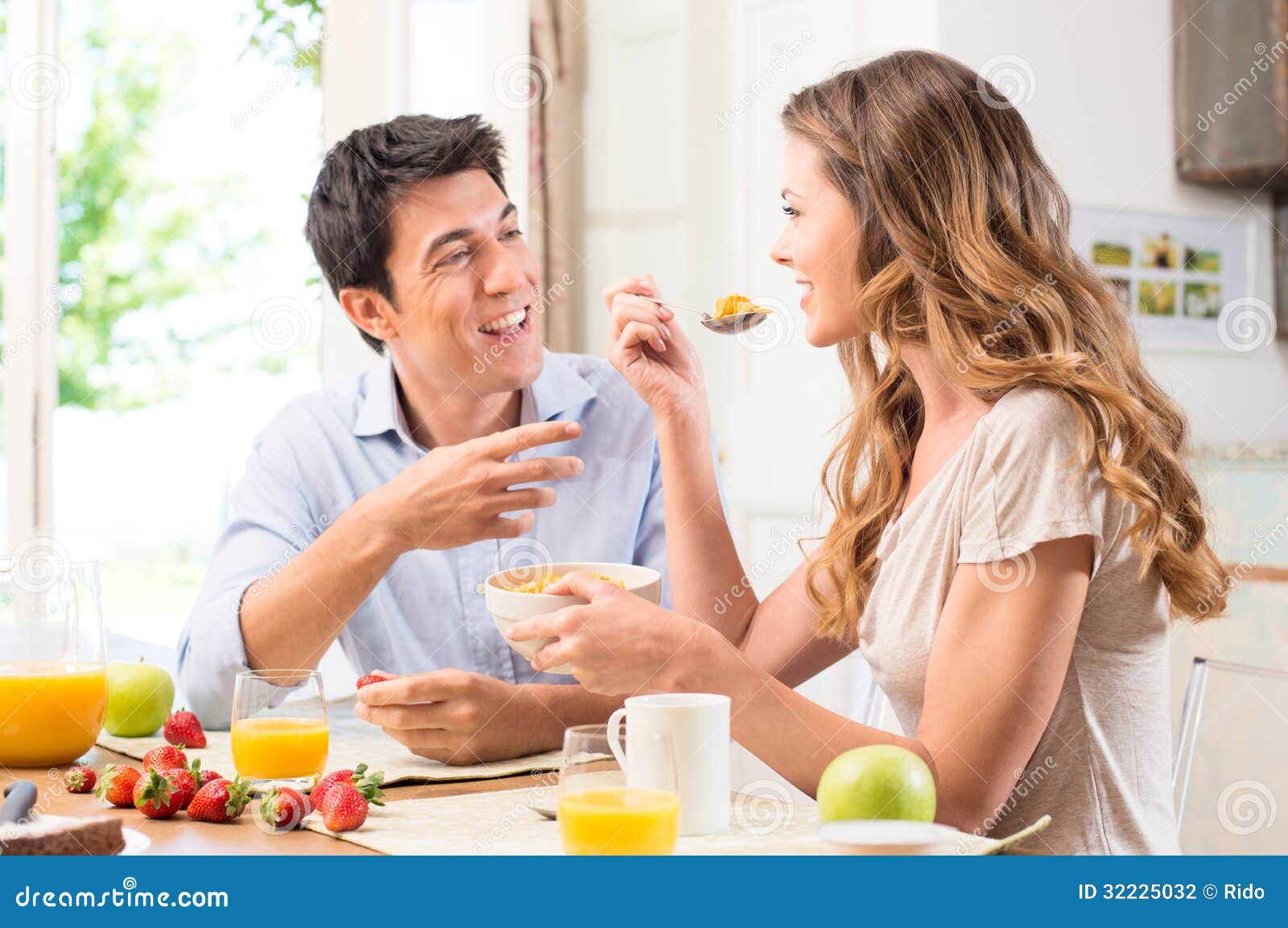 Couple Enjoying Breakfast stock photo. Image of loving - 32225032