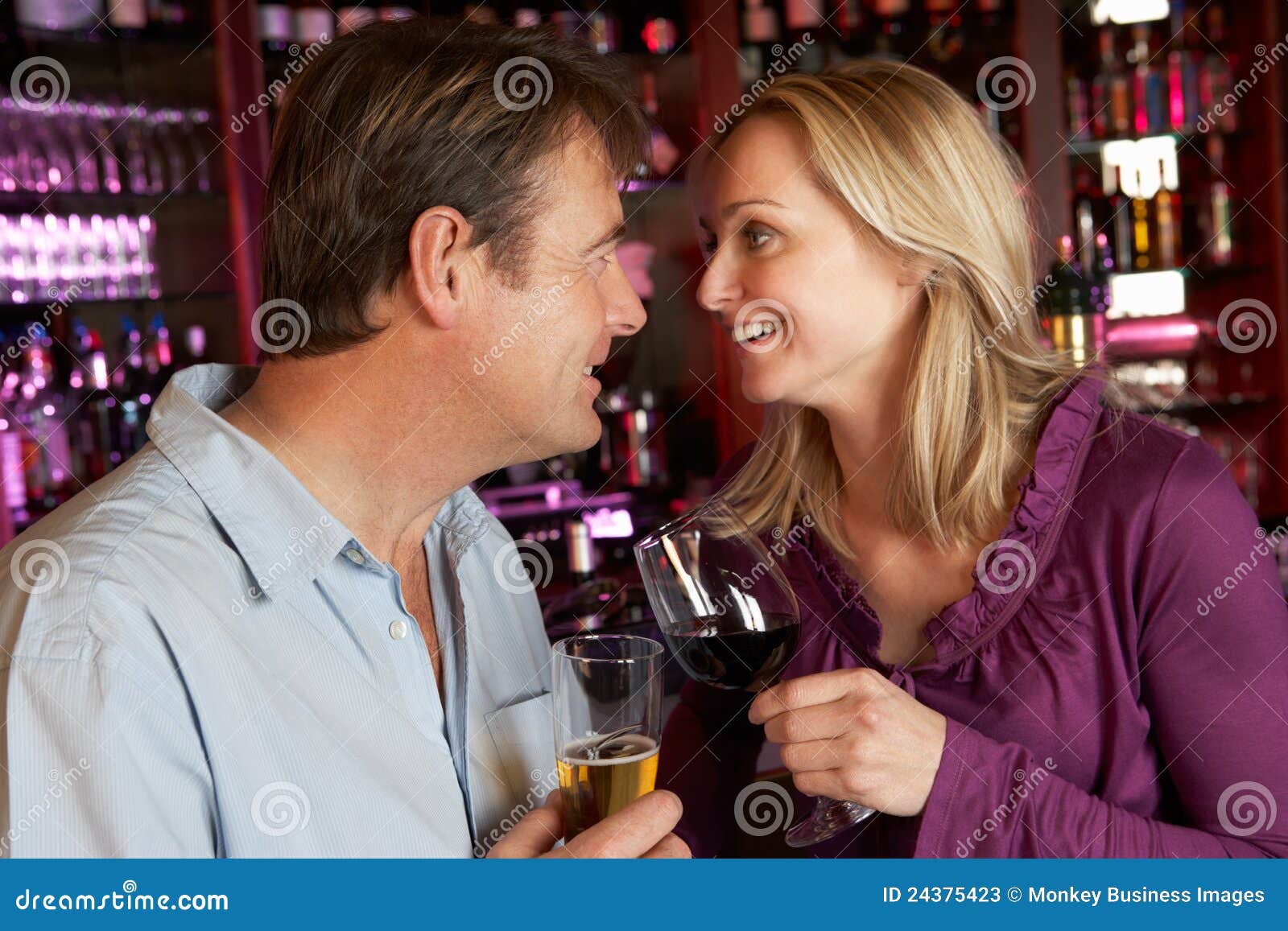 Couple Enjoying Drink Together in Bar Stock Image - Image of indoors ...