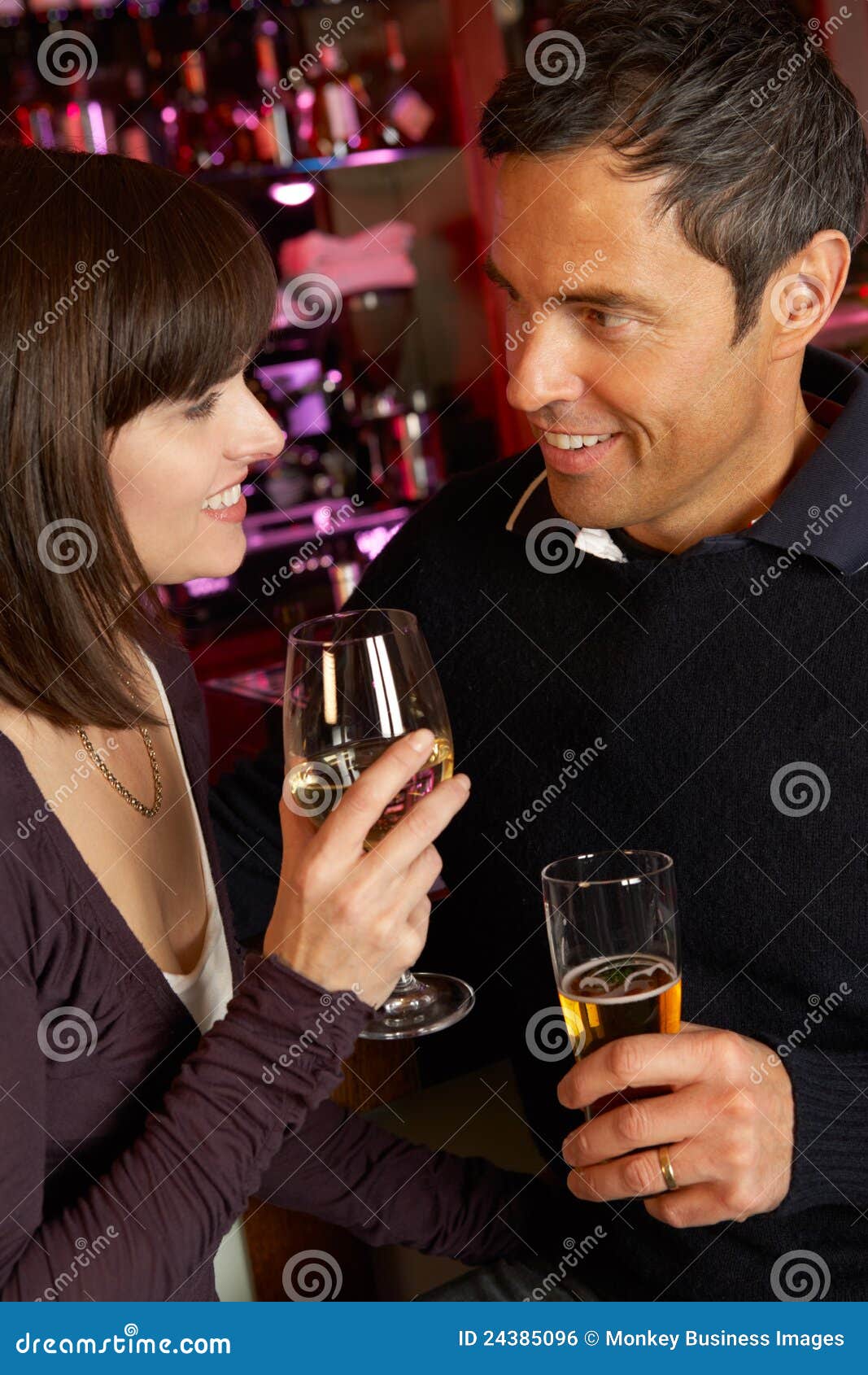 Couple Enjoying Drink Together in Bar Stock Photo - Image of chatting ...