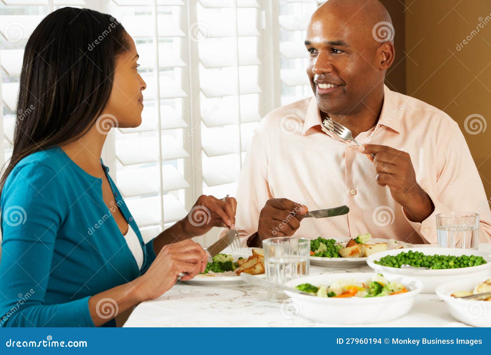Couple Enjoying Meal at Home Stock Photo - Image of couple, meal: 27960194
