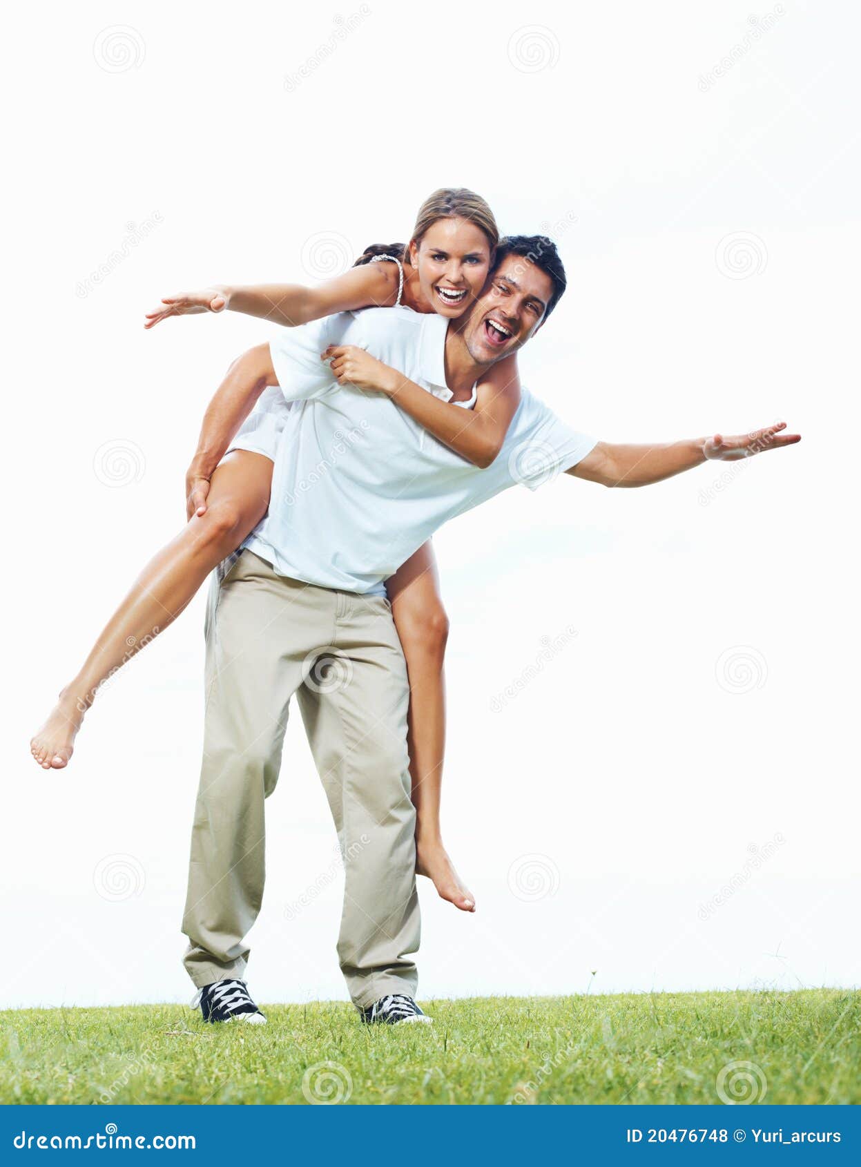 Couple Enjoying Piggyback Ride Stock Photo - Image of looking, casual ...