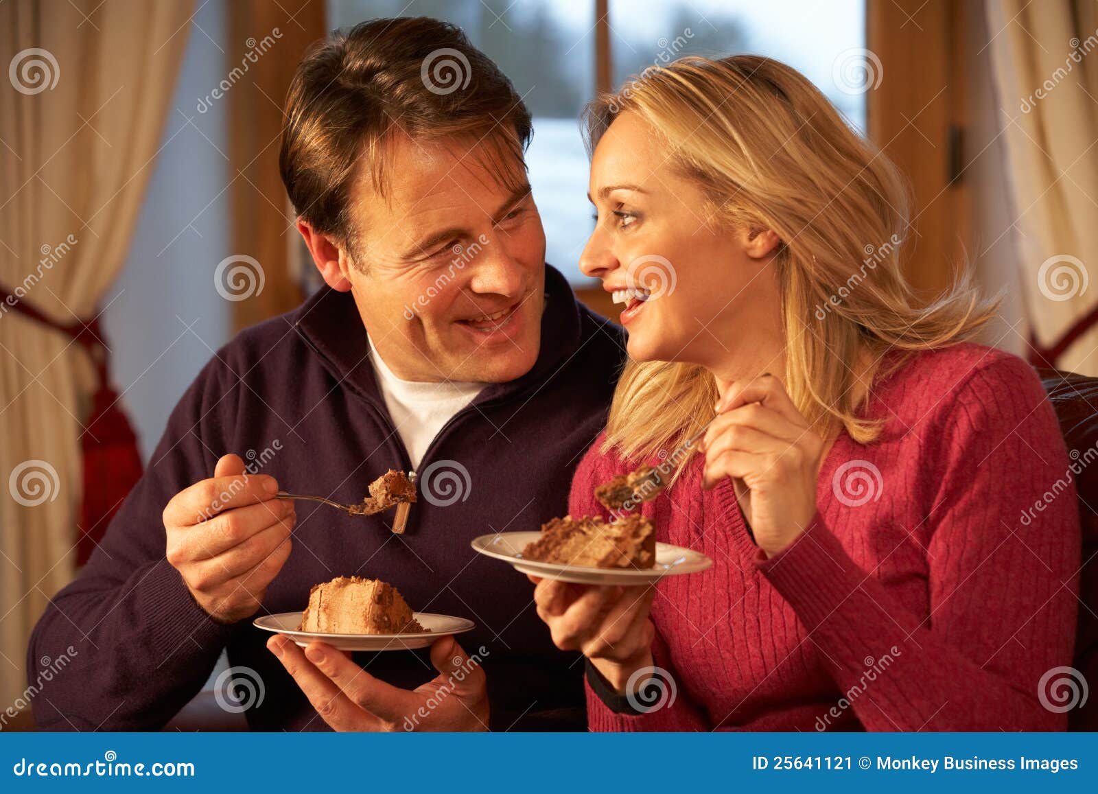 Couple Enjoying Slice of Cake Sitting on Sofa Stock Image - Image of ...