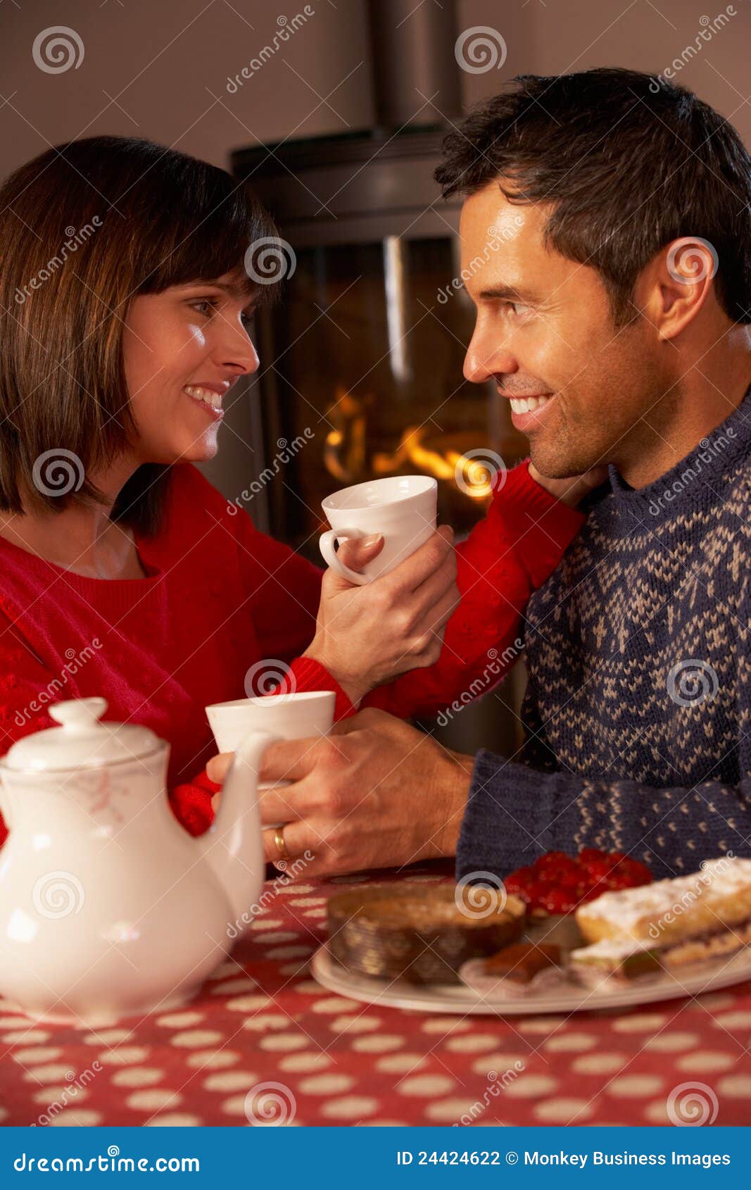 Couple Enjoying Tea and Cake by Cosy Log Fire Stock Photo - Image of ...