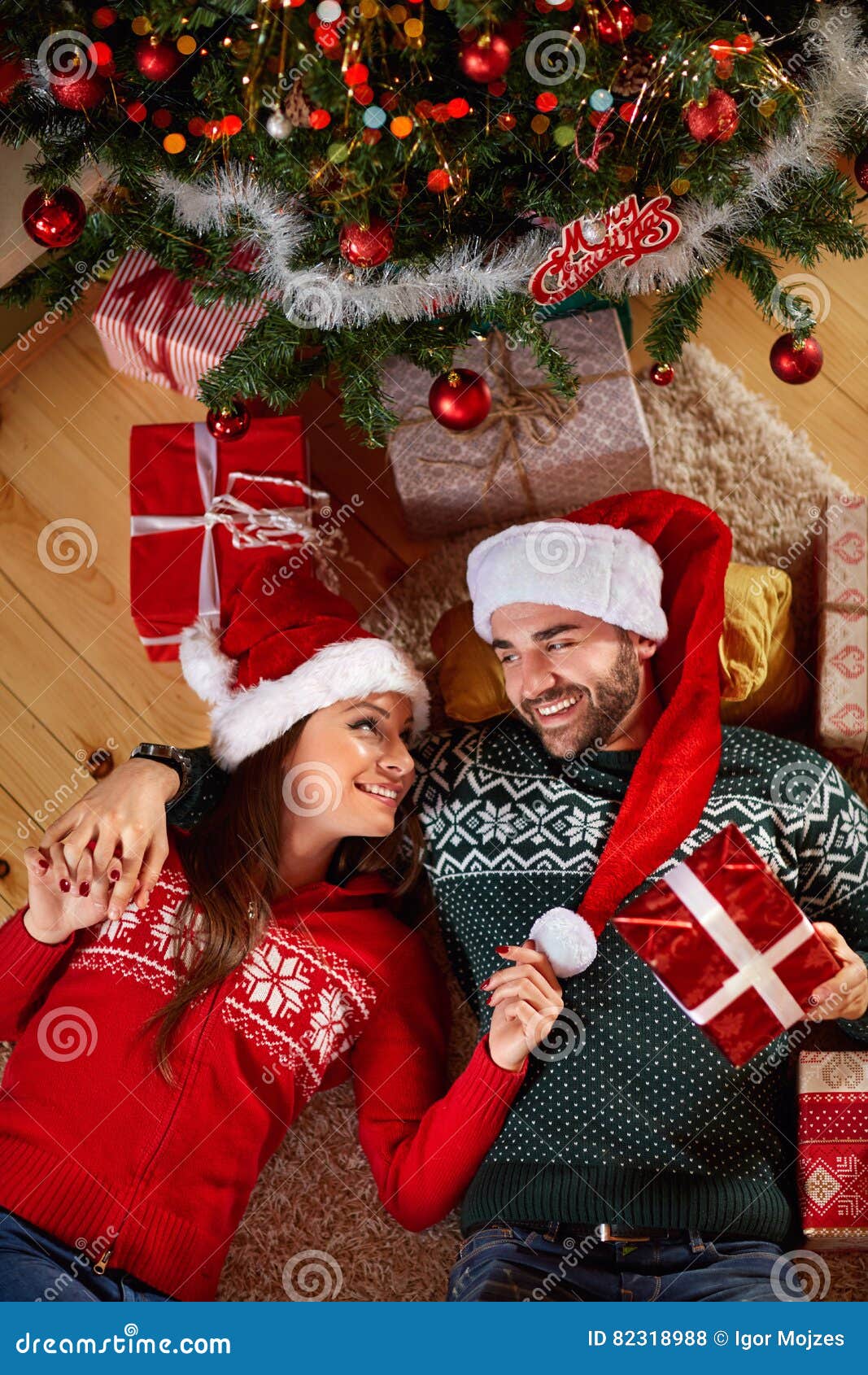 Couple Enjoying Under the Christmas Tree Stock Photo - Image of ...