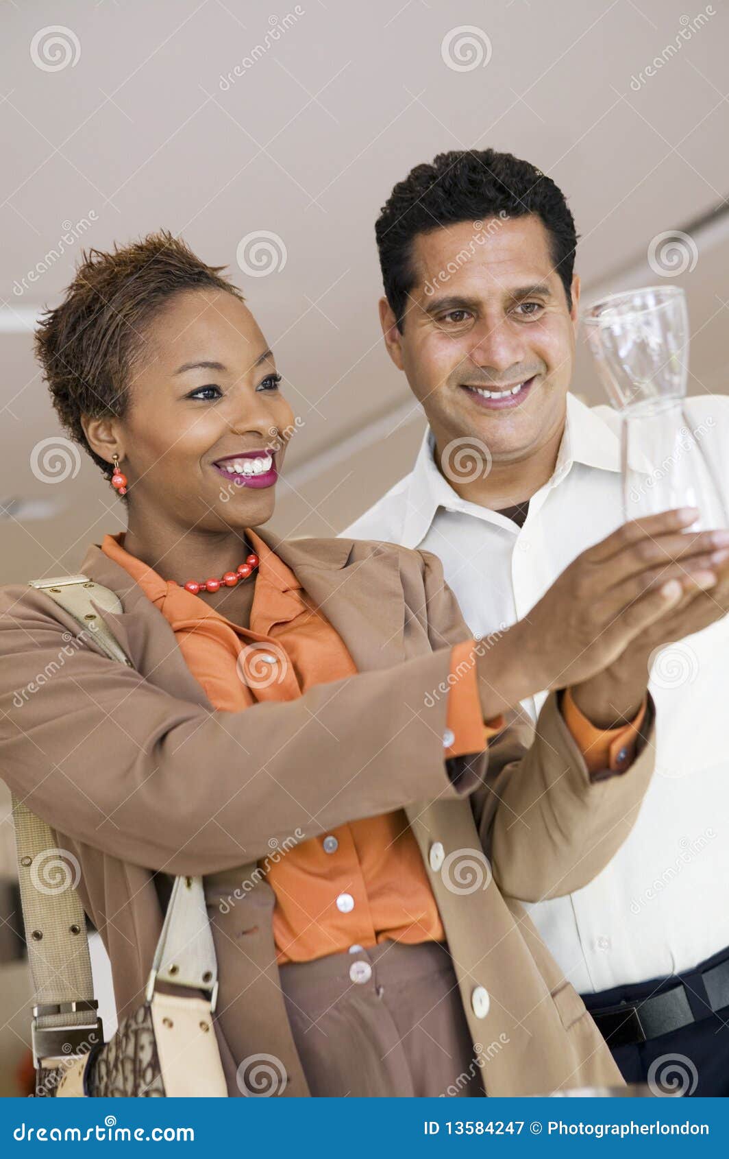 Couple Examining Glass Vase Stock Image - Image of standing, container ...