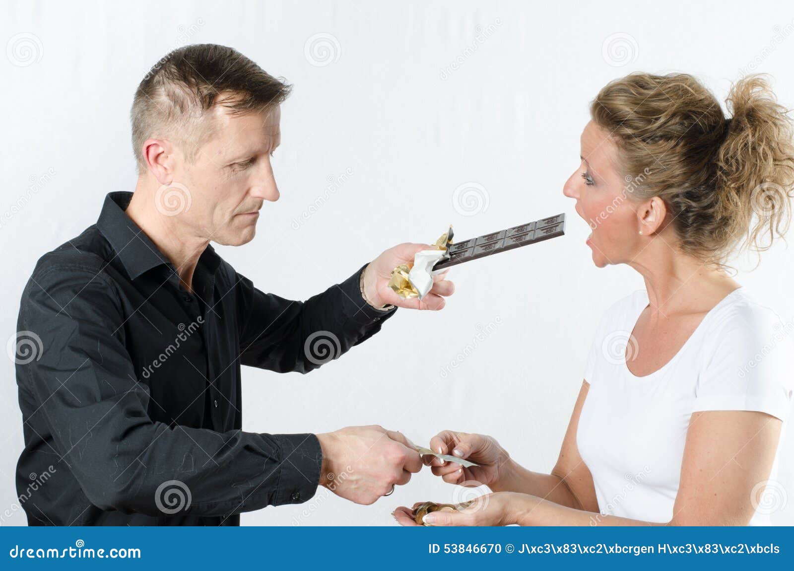 Couple Exchanging Money Against Chocolate Stock Photo - Image of woman ...