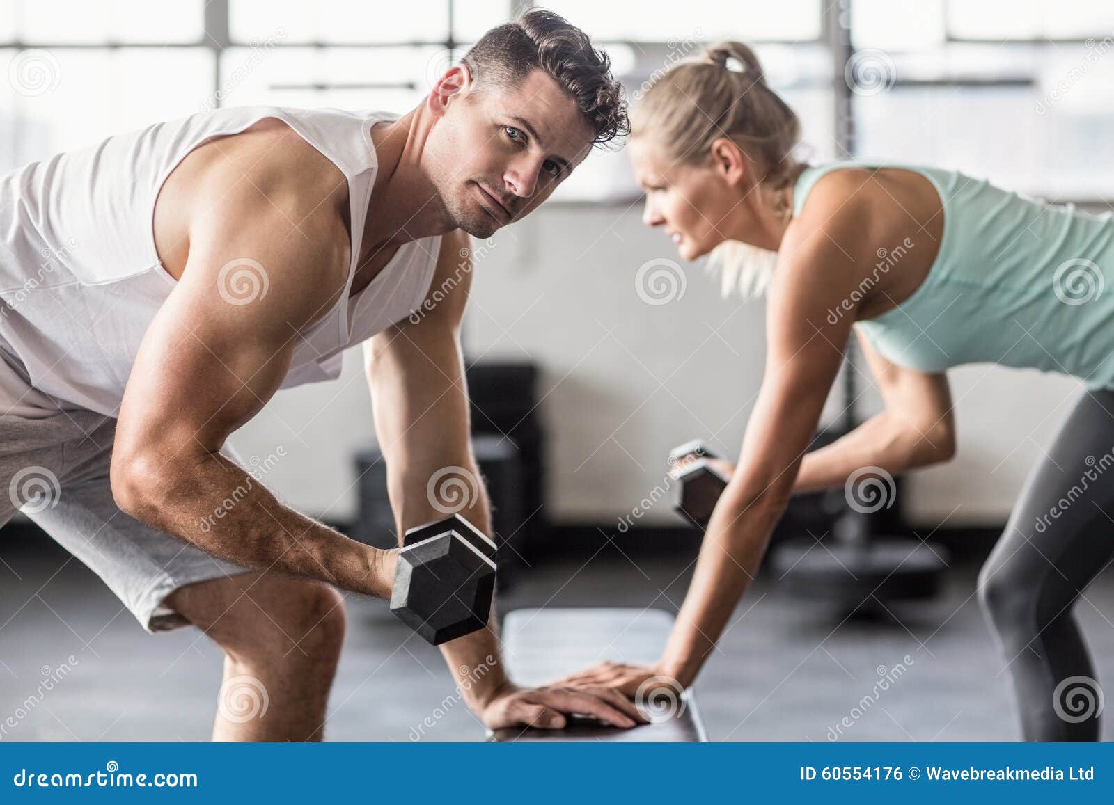 Couple Exercising with Dumbbells in Gym Stock Photo - Image of crossfit ...