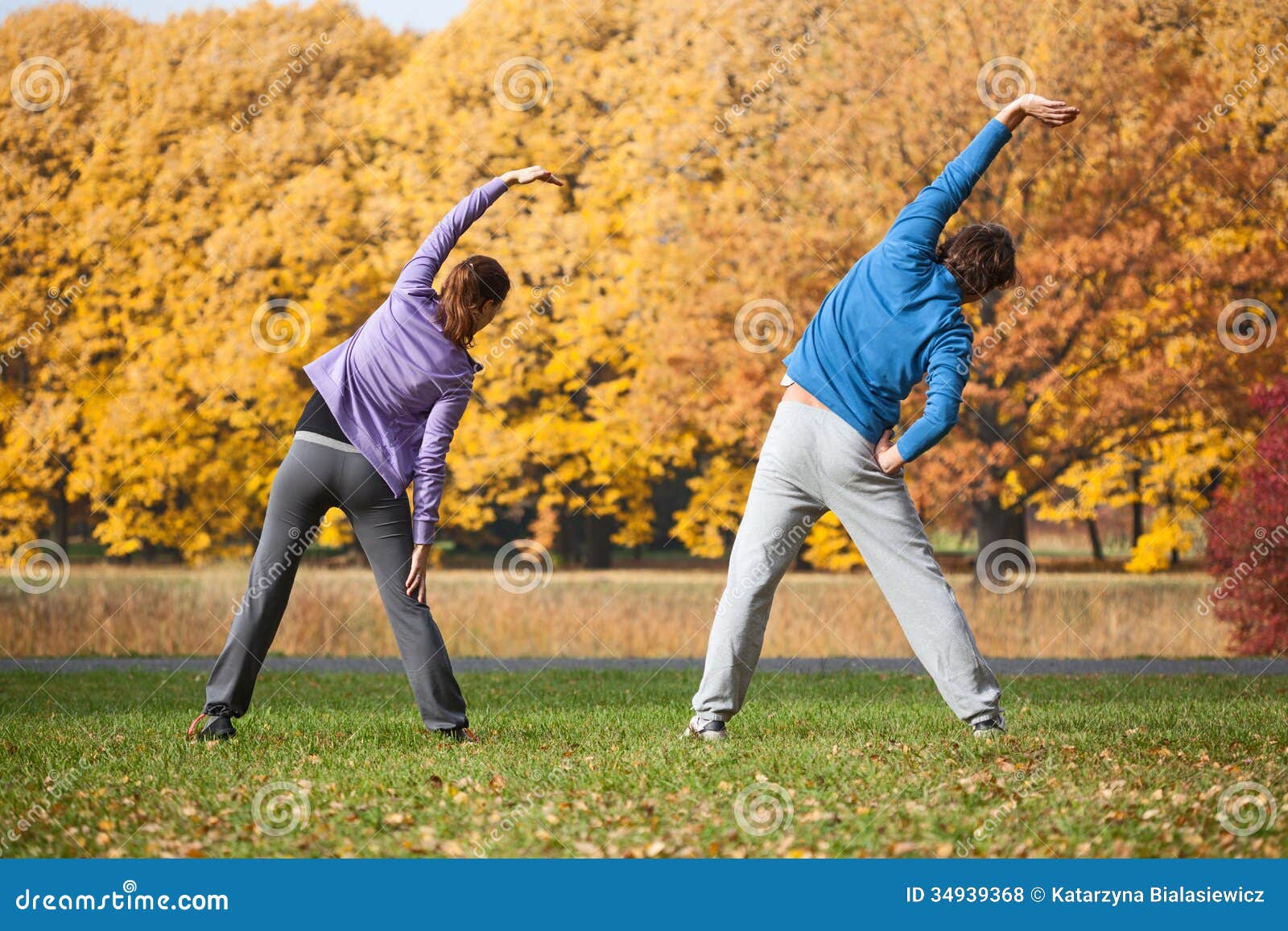 Couple Exercising in Park in Fall Stock Photo - Image of lifestyle ...