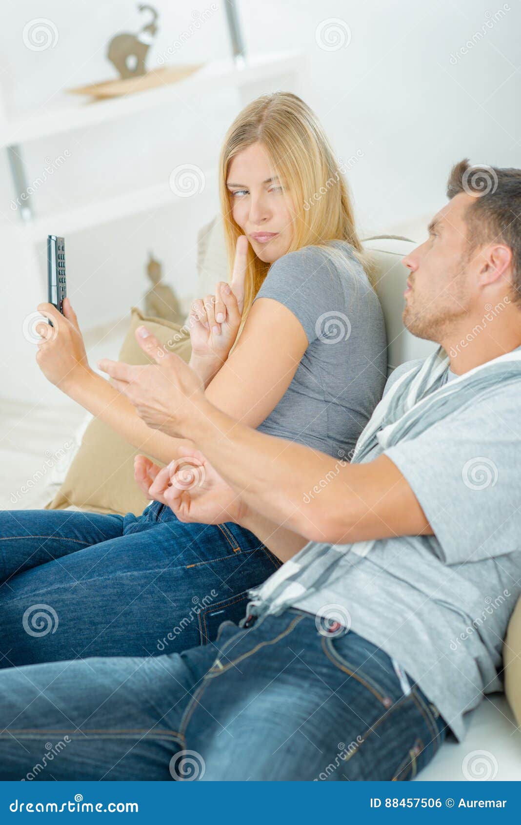 Couple Fighting Over TV Remote Stock Photo - Image of male, laughing ...