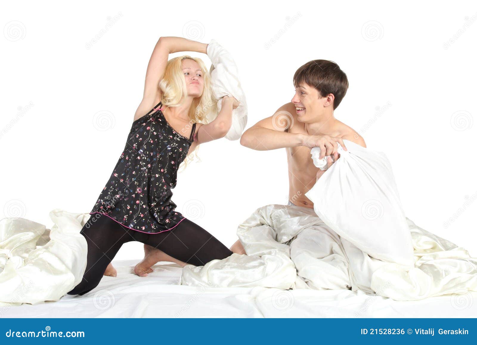 Couple Fighting with Pillows in Bed Stock Photo - Image of playful ...