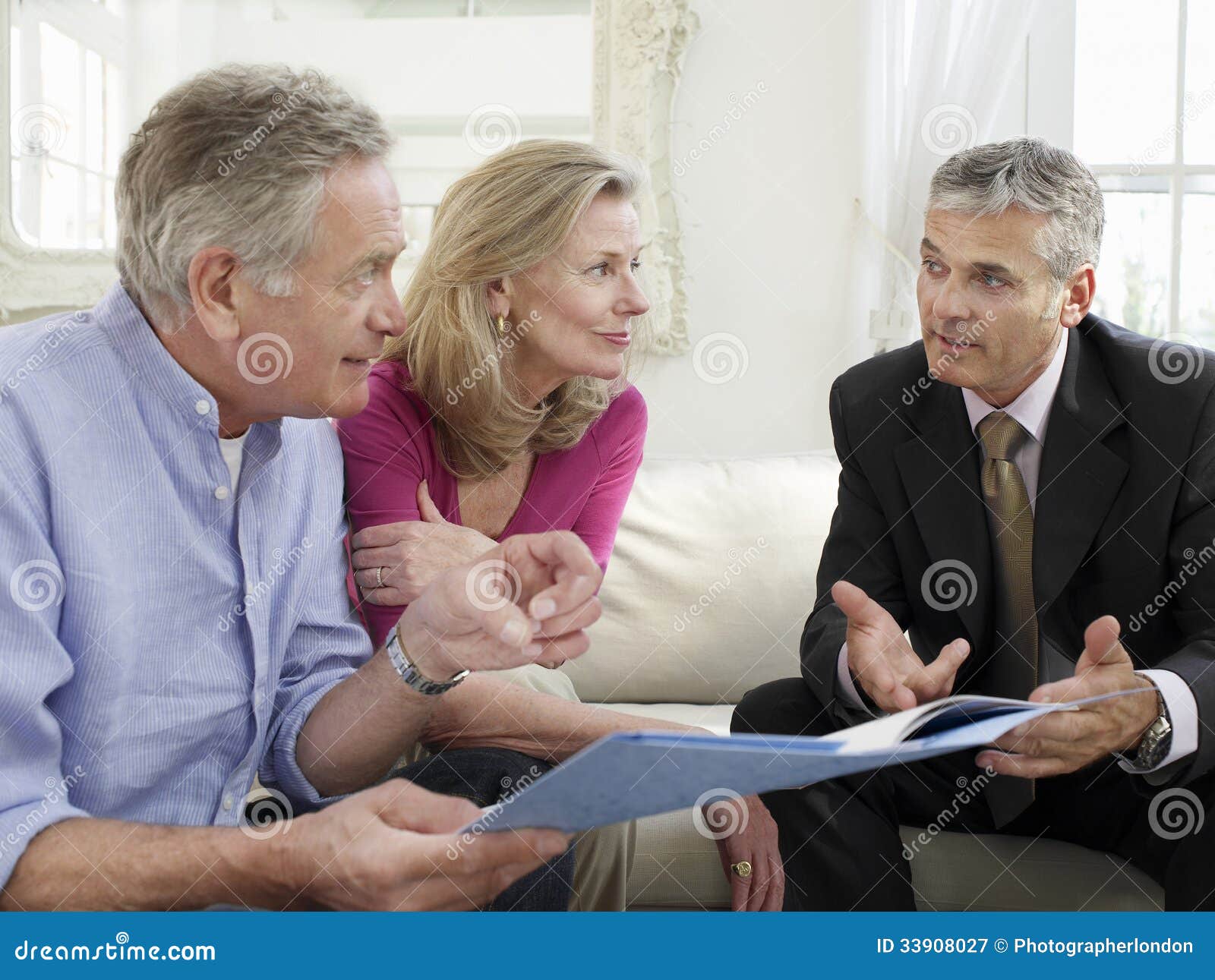 Couple with Financial Advisor at Sofa Stock Image - Image of advisor ...