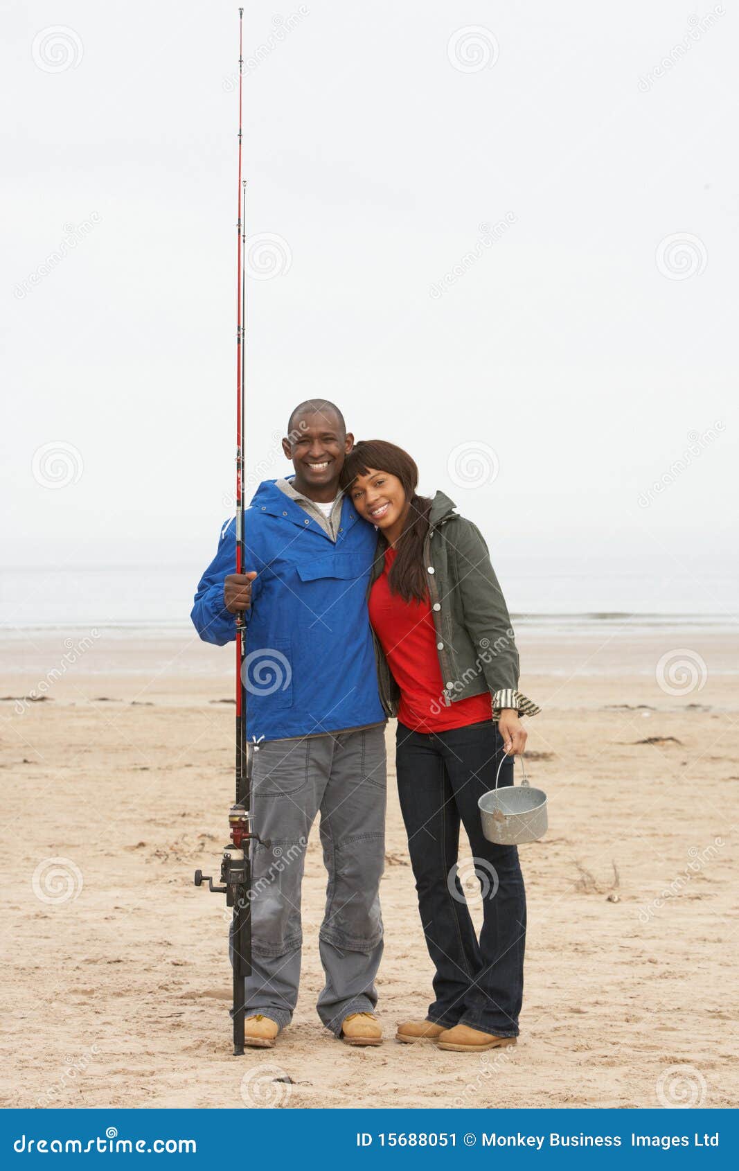 Couple Fishing on Beach stock image. Image of person - 15688051