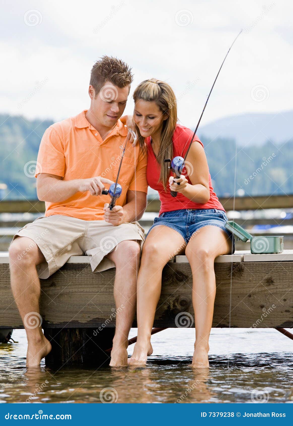 Couple fishing on pier stock photo. Image of recreation - 7379238