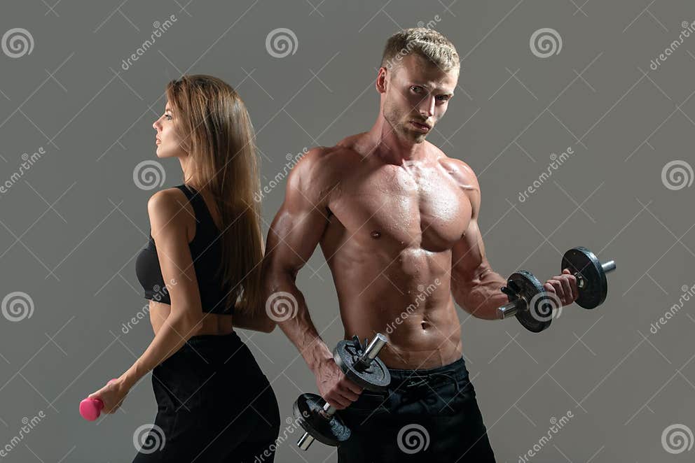 Couple Of Fit Bodybuilders Muscular Man And Beautiful Girl With