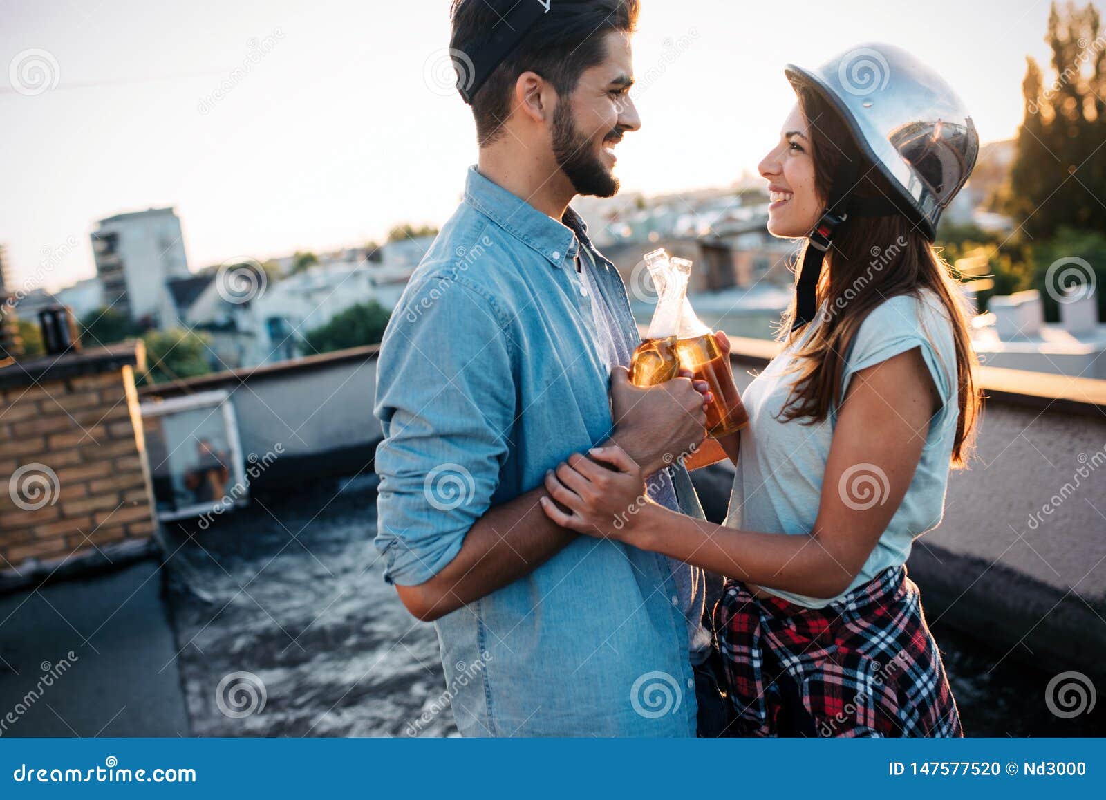 Couple Flirting while Having a Drink on Rooftop Terrasse Stock Photo ...