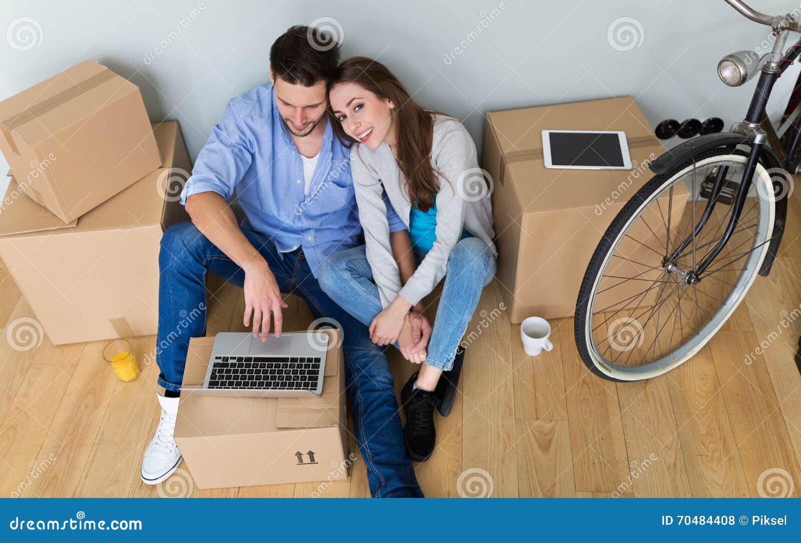 Couple on Floor Next To Moving Boxes Stock Photo - Image of carefree ...
