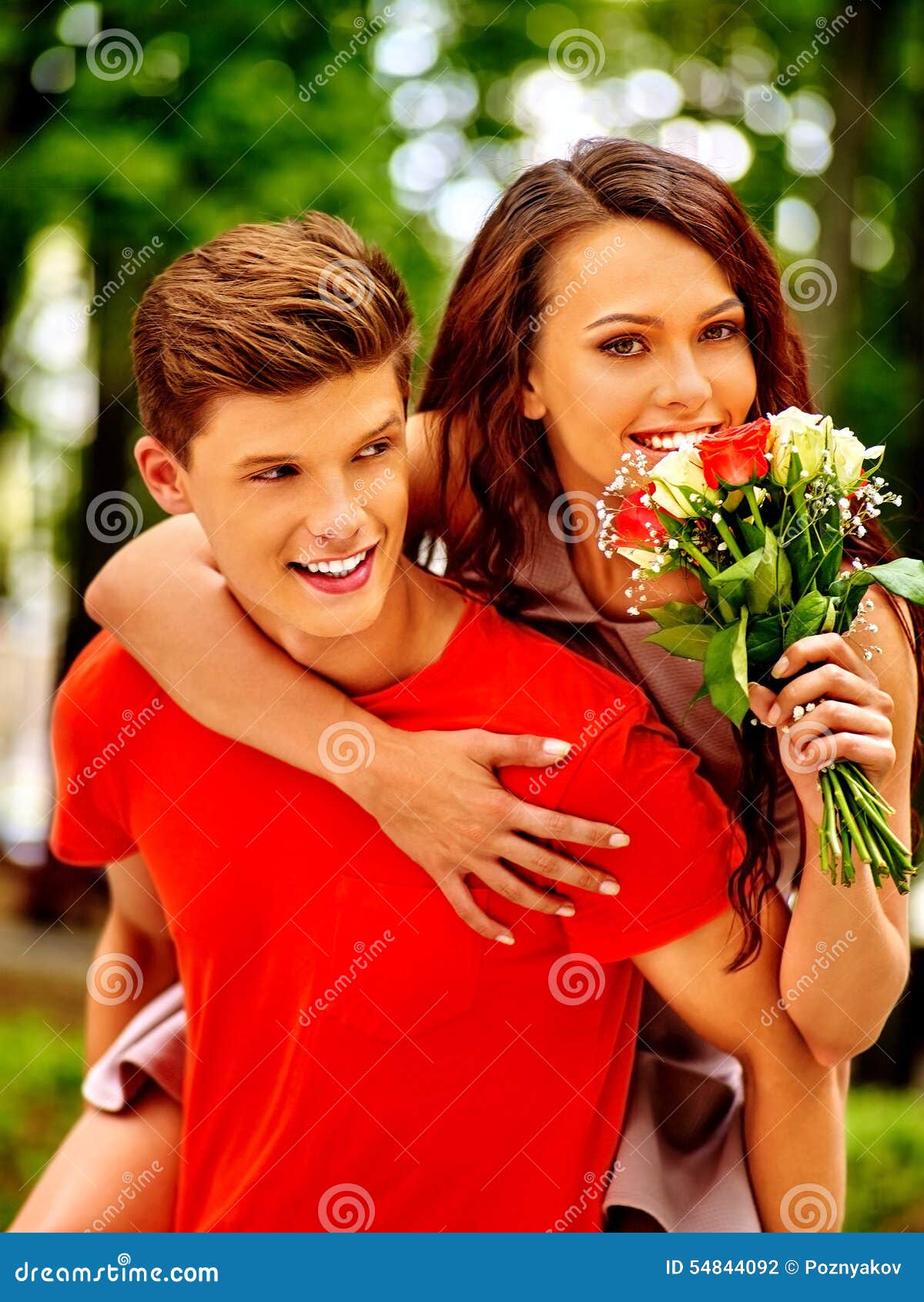 Couple with flower at park stock photo. Image of city - 54844092