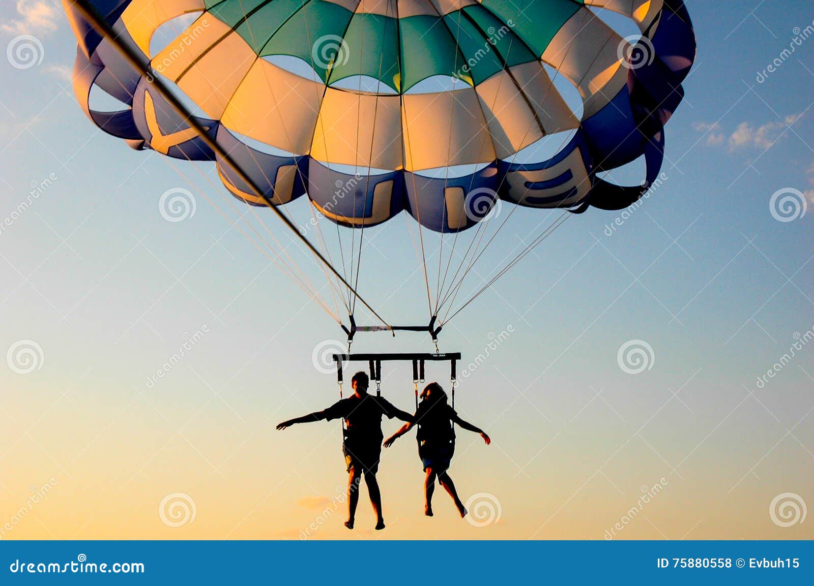 A Couple Flying on a Parachute. Editorial Stock Photo - Image of water ...