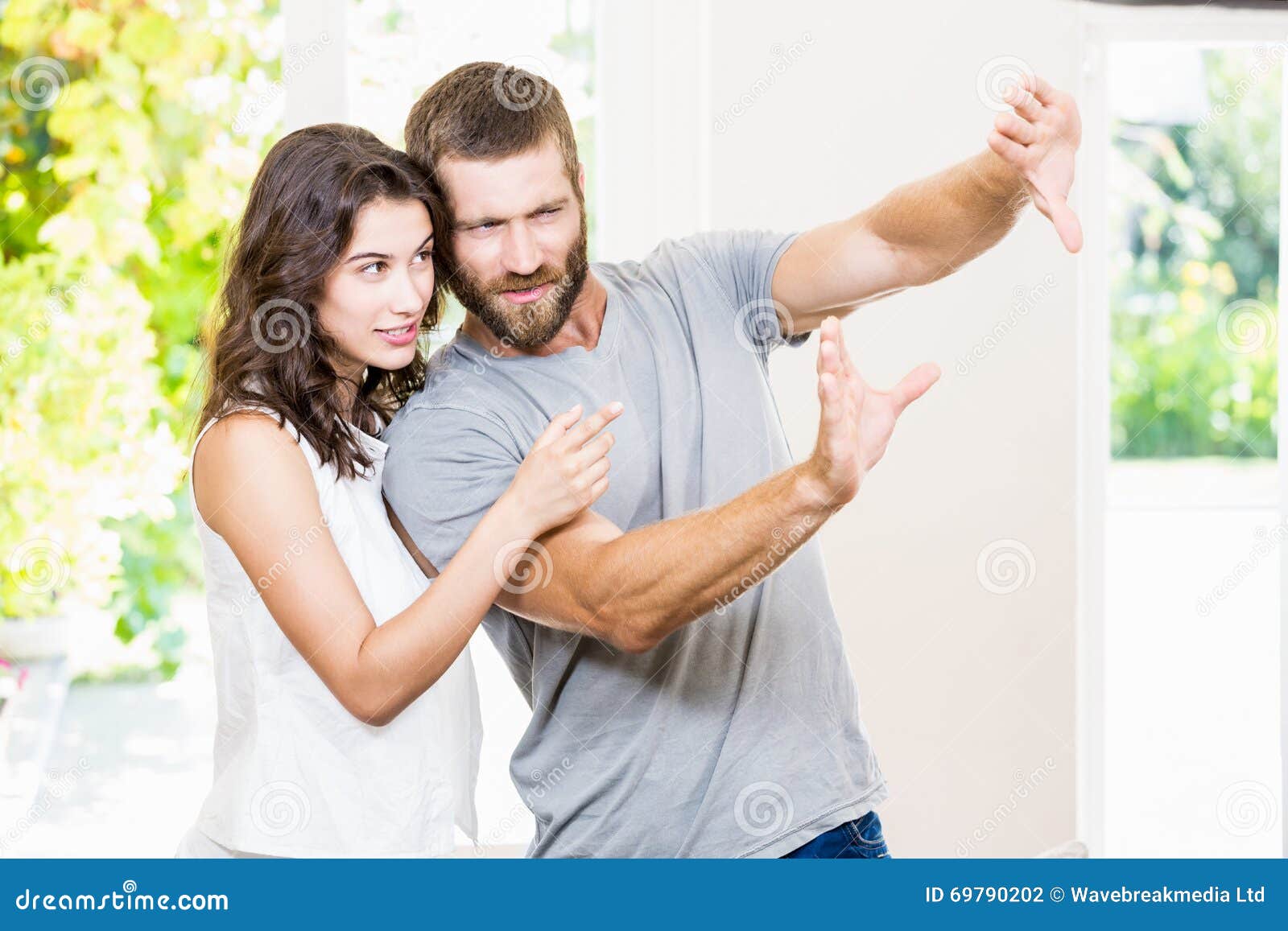 Couple Framing a Picture with Hands Stock Photo - Image of cheerful ...